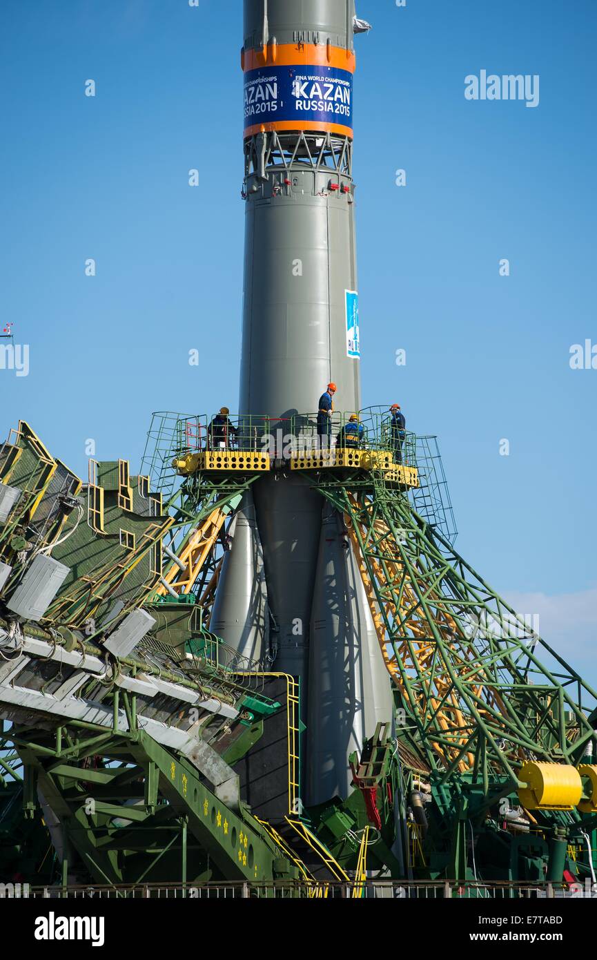 ROSCOSMOS workers prepare the gantry arms around the Soyuz TMA-14M ...