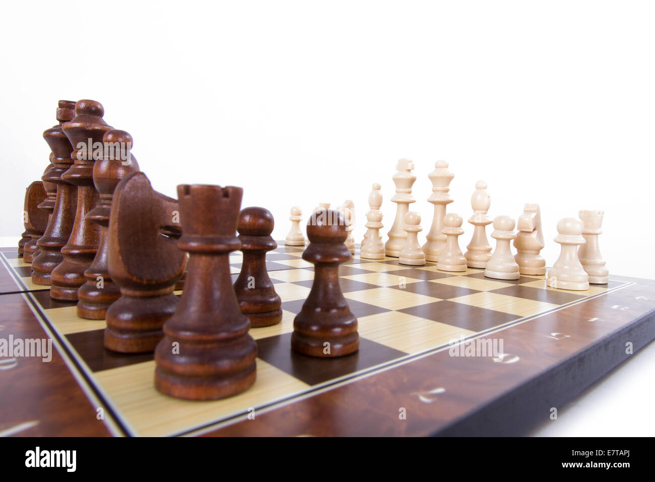 Chess board with chess pieces in a row, isolated on white background ...