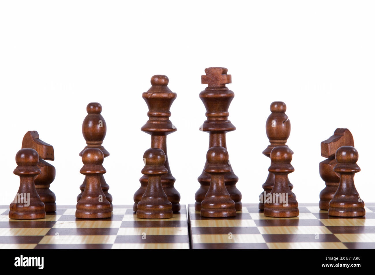 Dark brown chess pieces on board, isolated on white background Stock ...