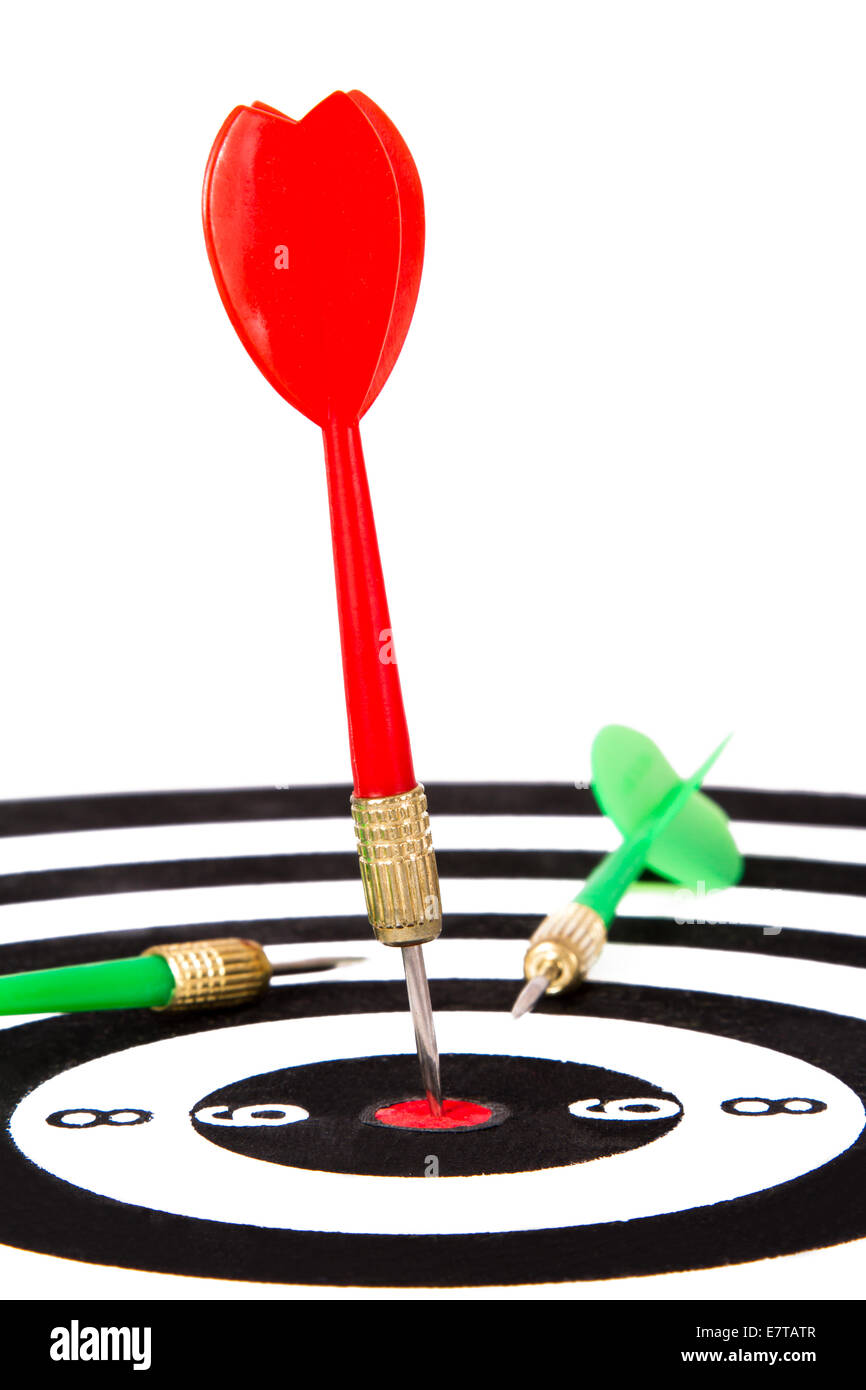 Red and green arrows on dart board, isolated on white background Stock ...