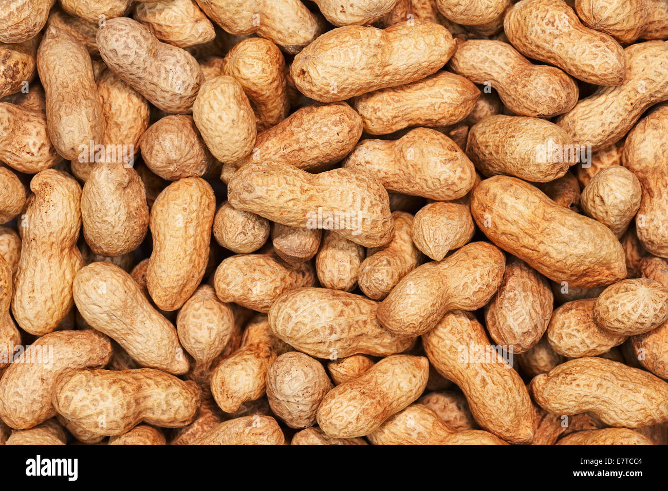 Dry roasted peanuts for use as background Stock Photo - Alamy