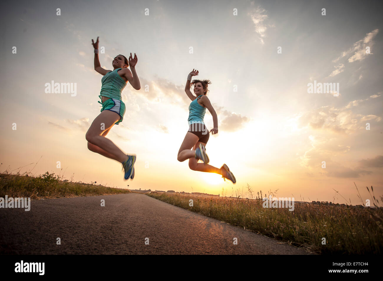 Two pretty girls jogging in the morning Stock Photo - Alamy