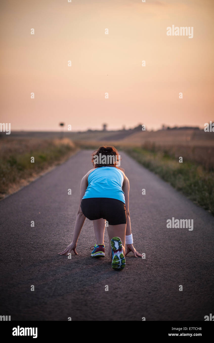 Sprinter start position on the track. Jogging sport Stock Photo - Alamy