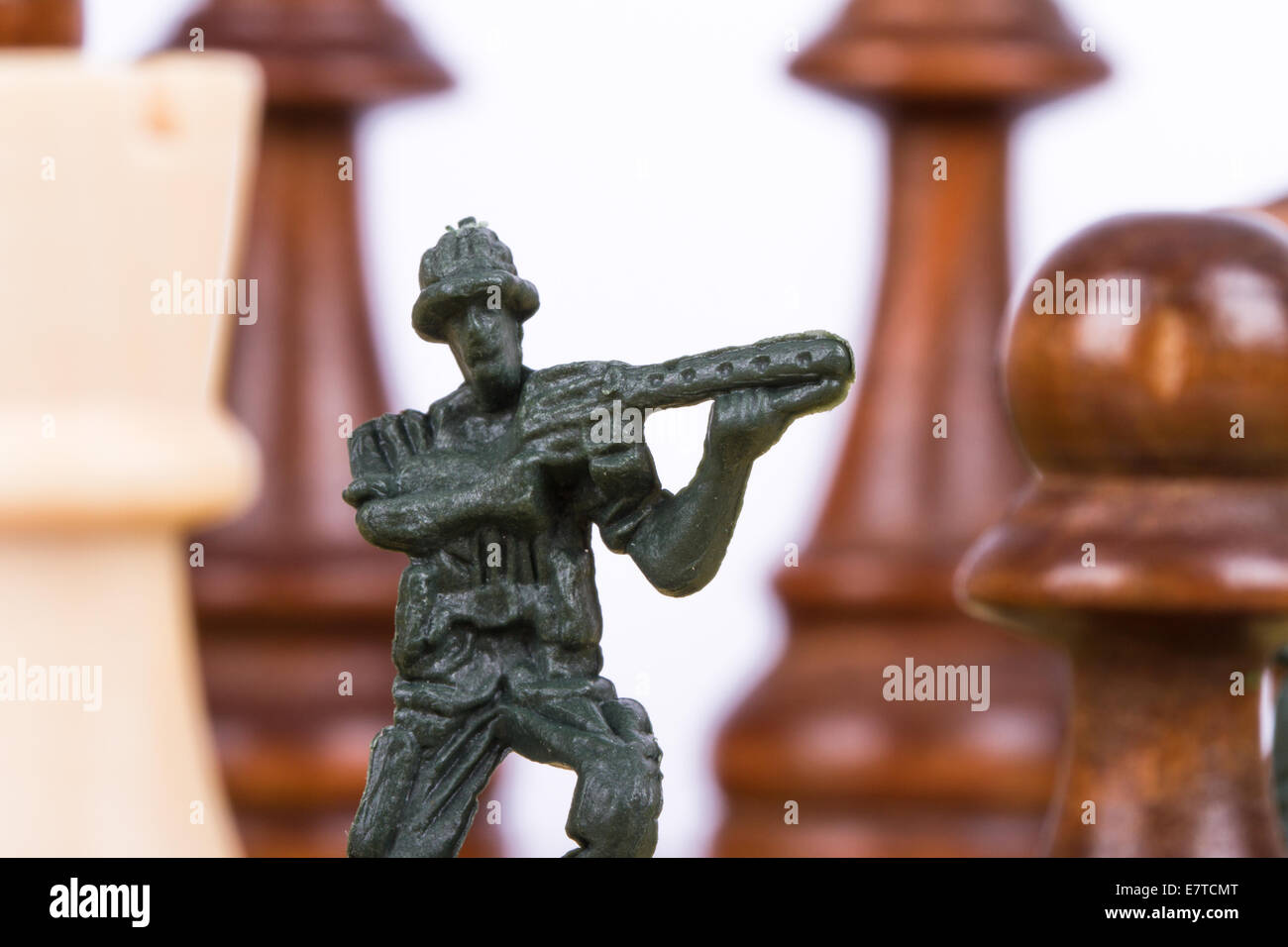 Miniature toy soldier on chess board Stock Photo - Alamy