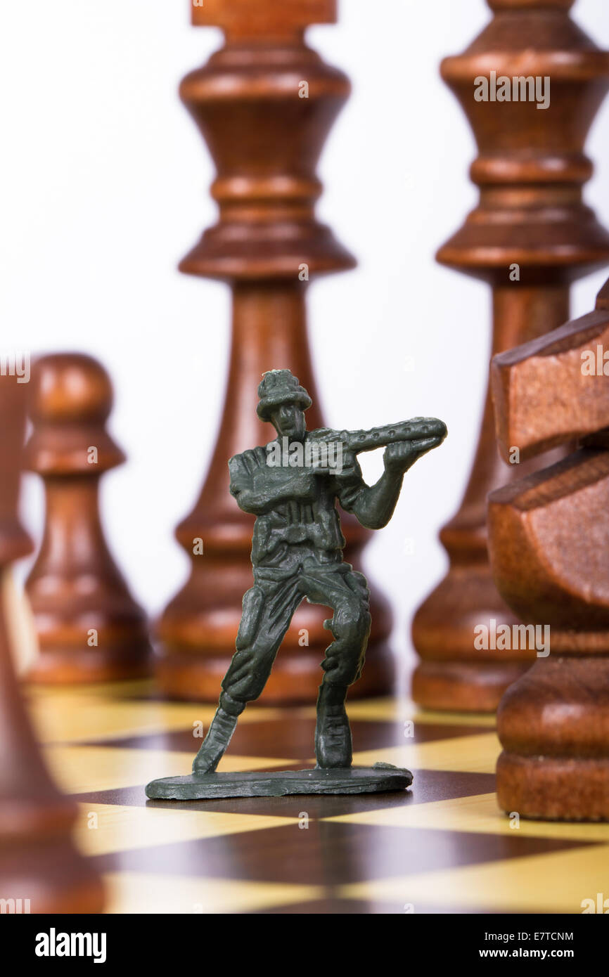 Close up view of miniature toy soldier on chess board Stock Photo - Alamy