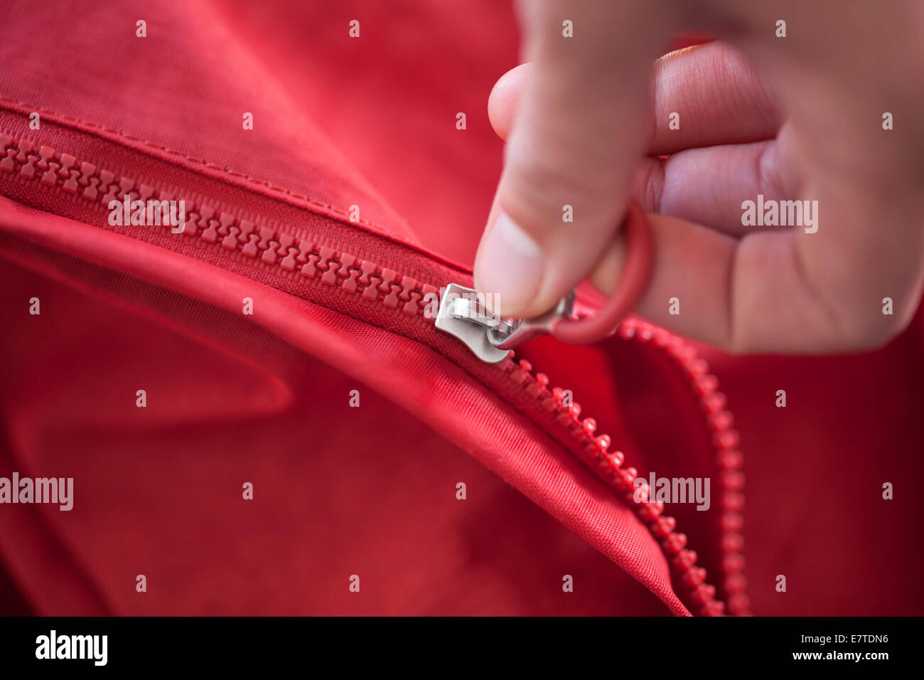 Unzipping hi-res stock photography and images - Alamy