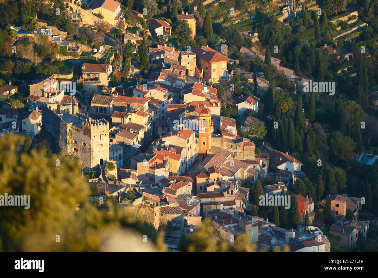 Roquebrune village with its medieval castle and church in the evening ...