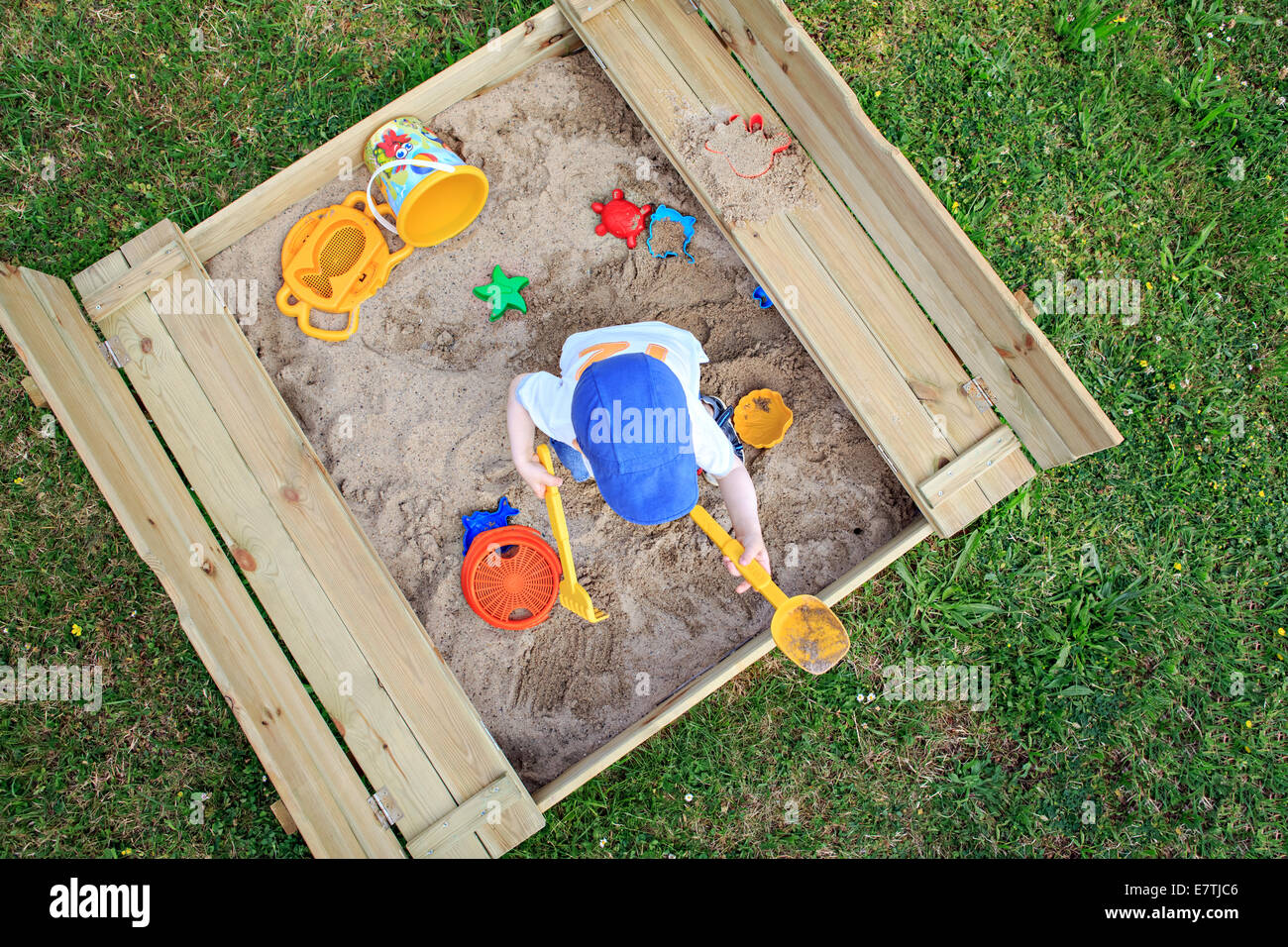 little male child playing in the sandbox Stock Photo - Alamy