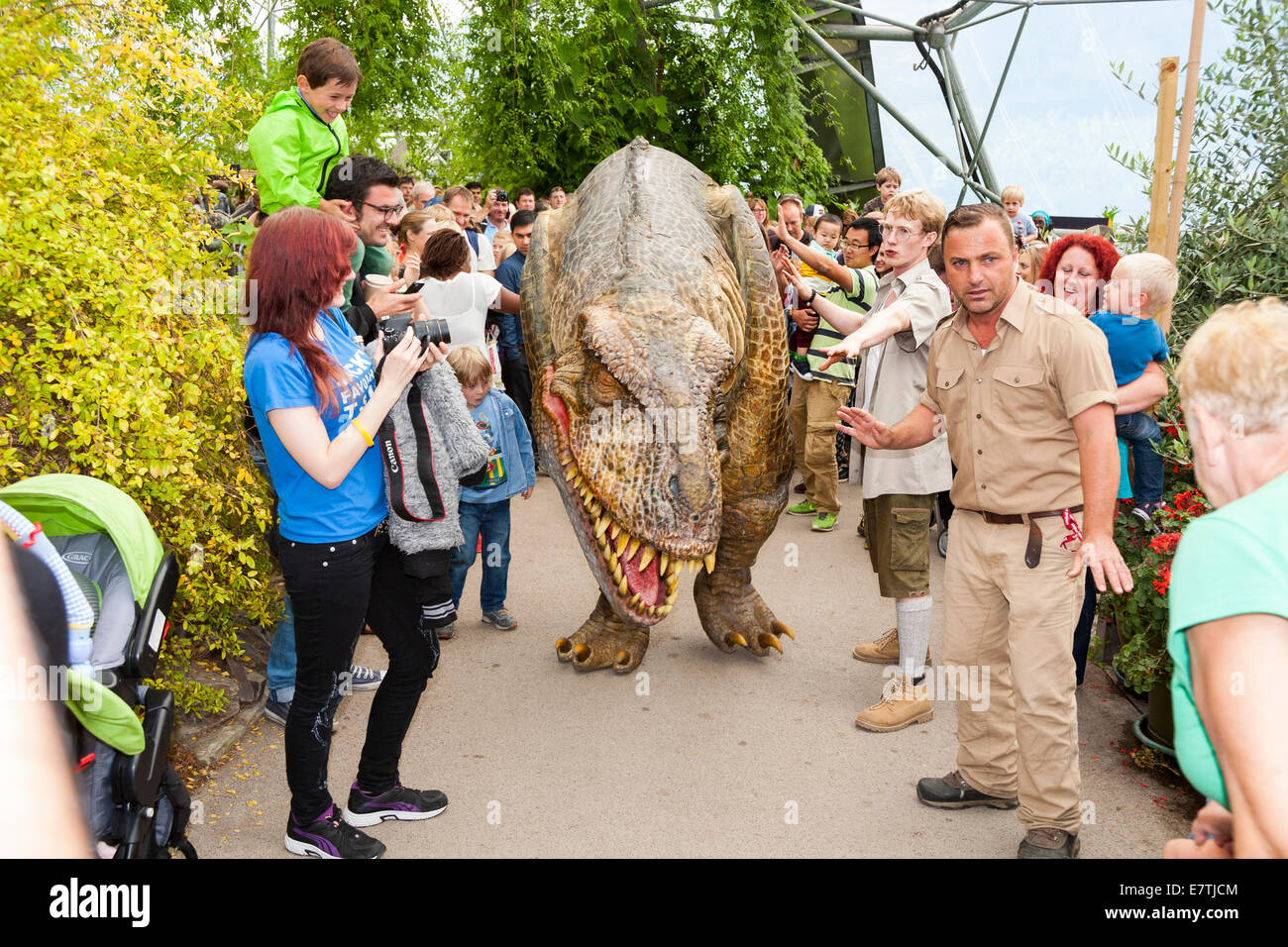 A Dinosaur on the loose (with guards) entertains children & families at ...