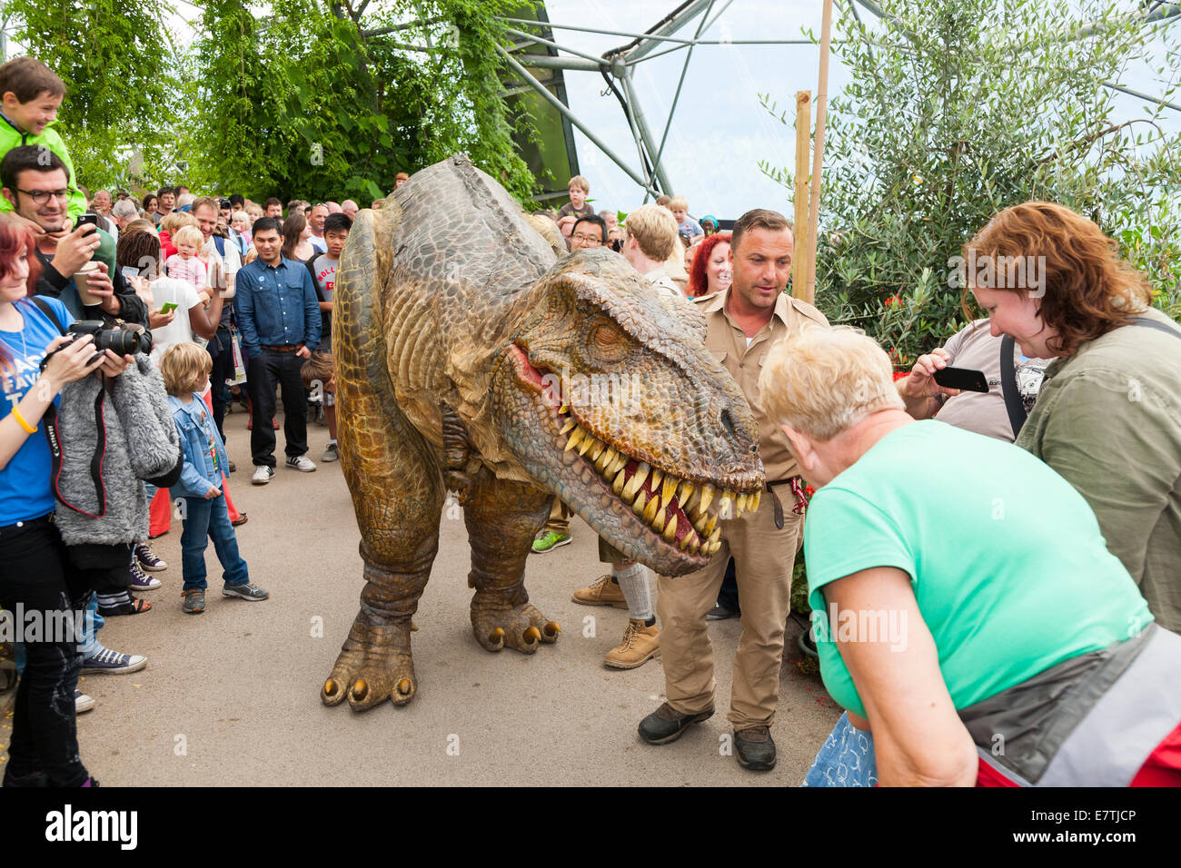 A Dinosaur on the loose (with guards) entertains children & families at ...