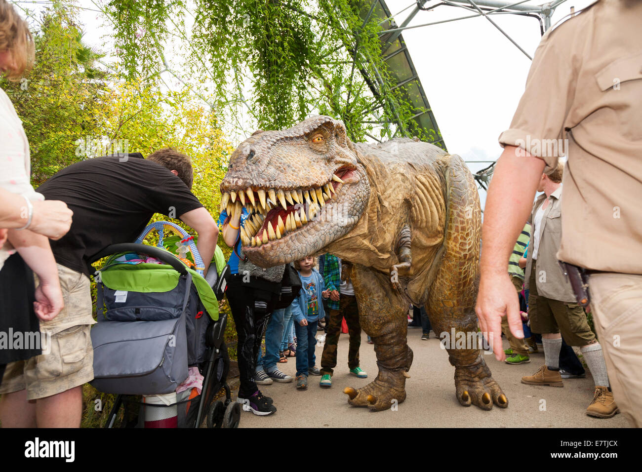 A Dinosaur on the loose (with guards) entertains children & families at ...