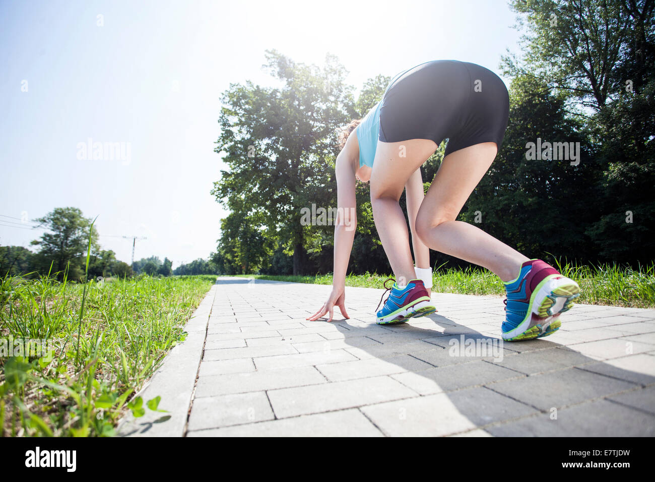Sprinter start position on the track. Jogging sport Stock Photo - Alamy
