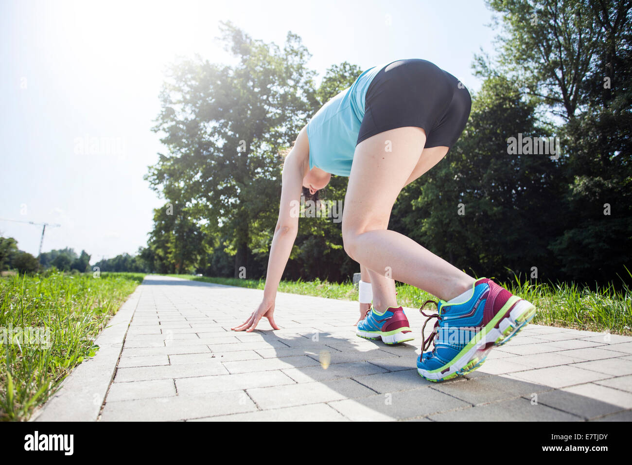 Sprinter start position on the track. Jogging sport Stock Photo - Alamy
