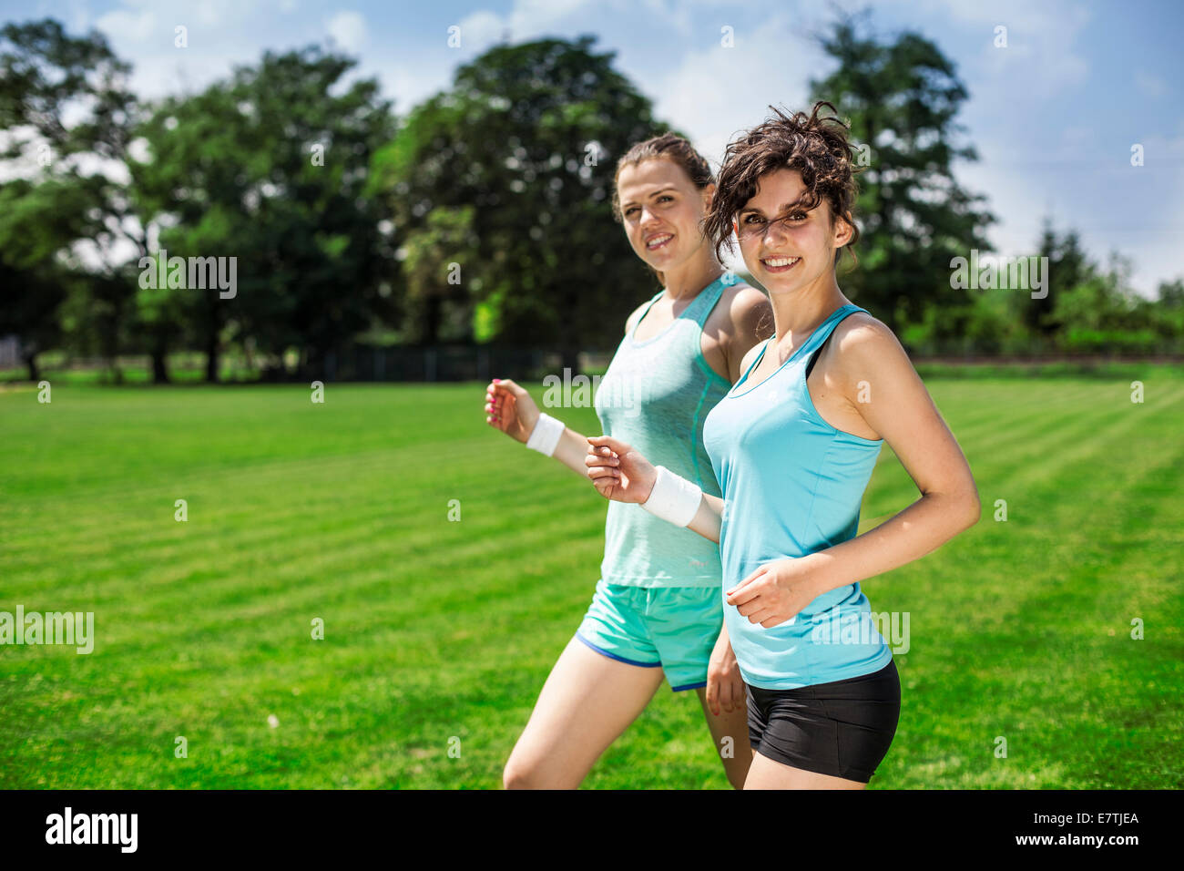 Two pretty girls jogging in the morning Stock Photo - Alamy
