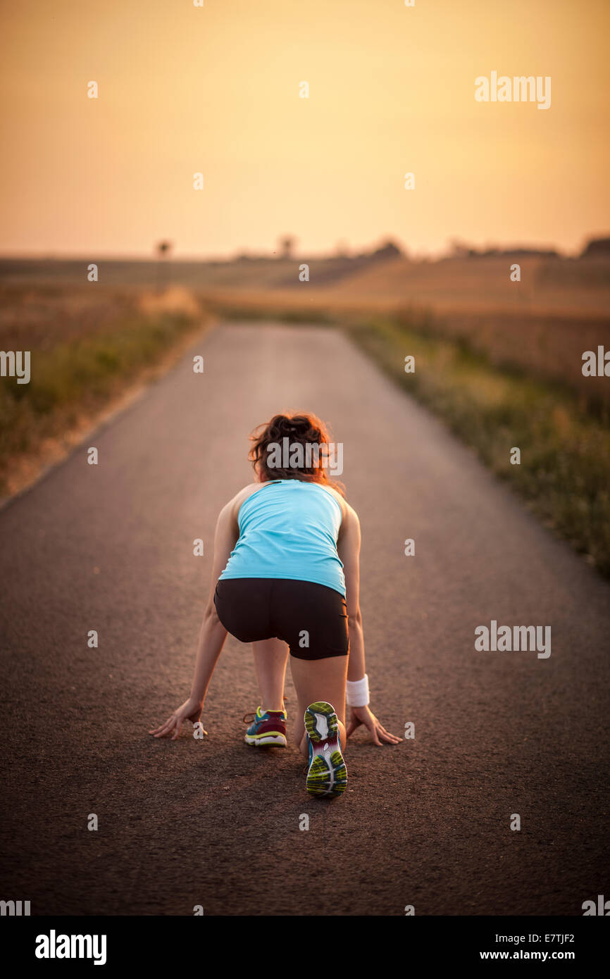 Sprinter start position on the track. Jogging sport Stock Photo - Alamy