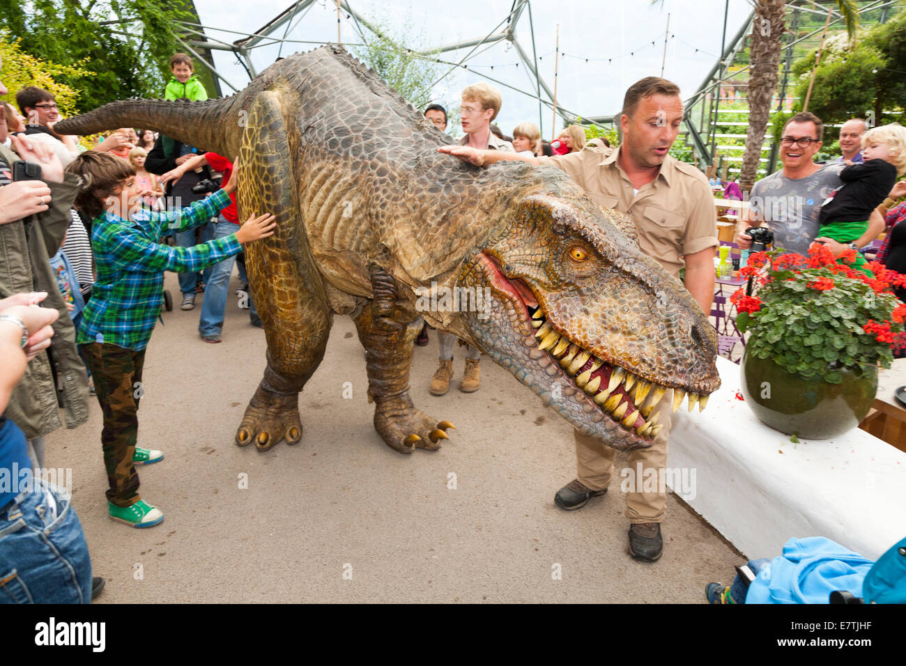 A Dinosaur on the loose (with guards) entertains children & families at ...