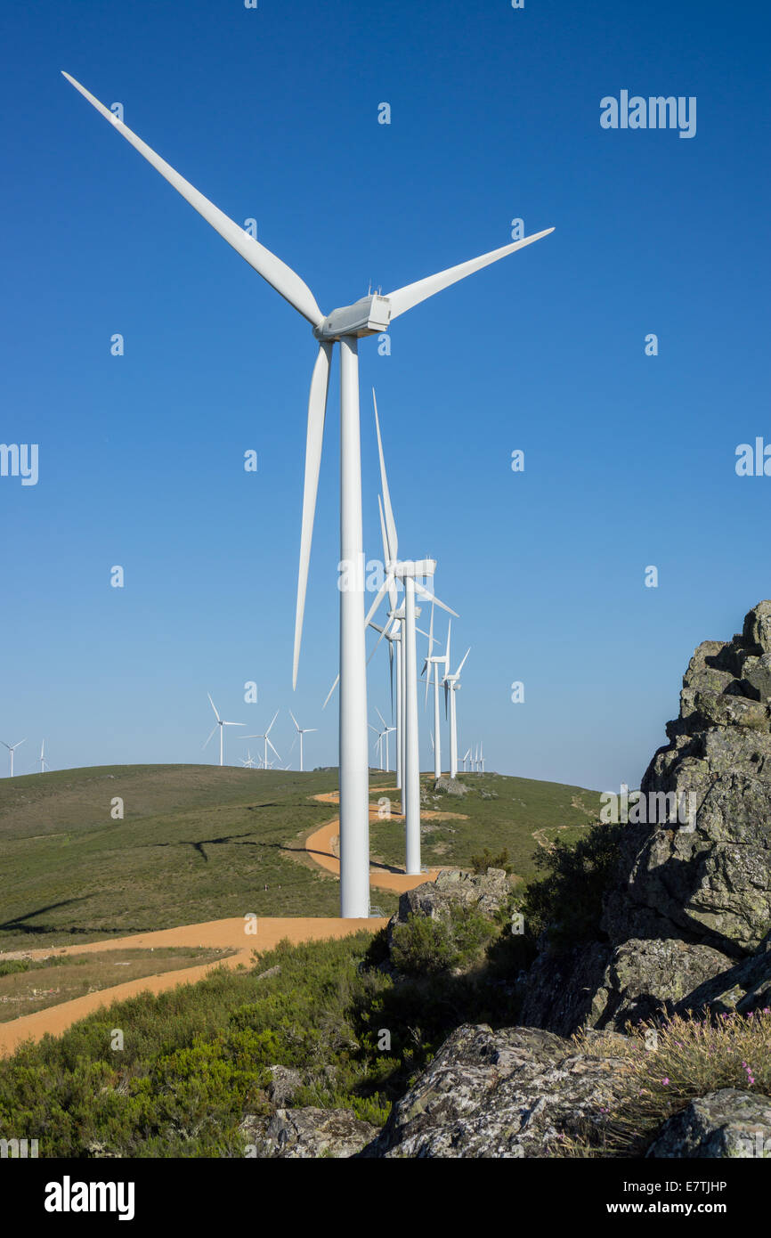 Wind turbines, track and rocks in the countryside Stock Photo - Alamy