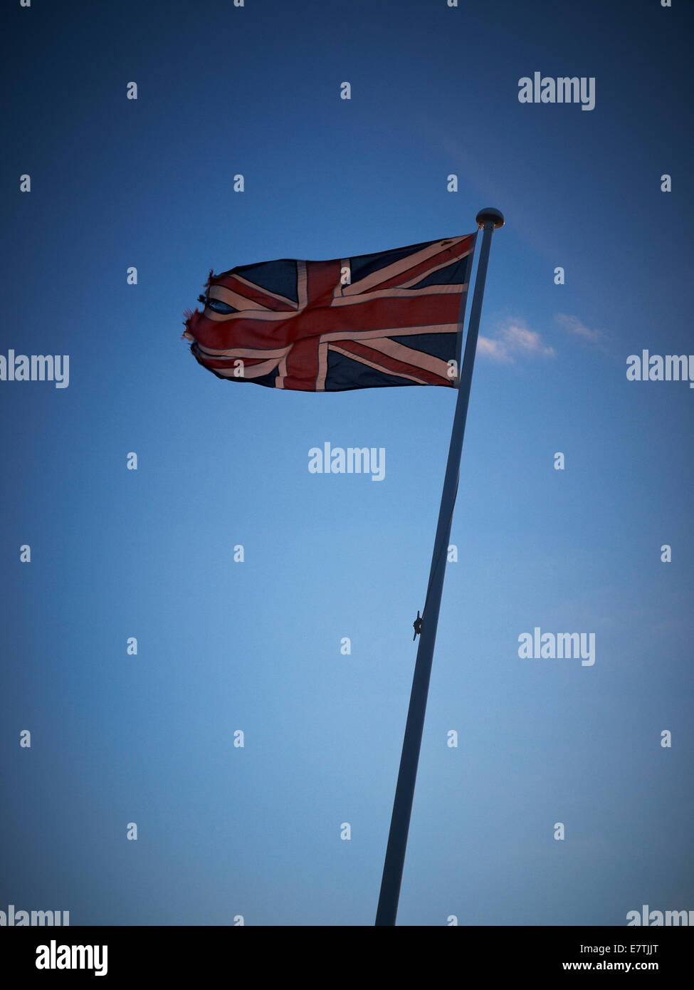Backlit Union Jack isolated against deep blue sky Stock Photo - Alamy