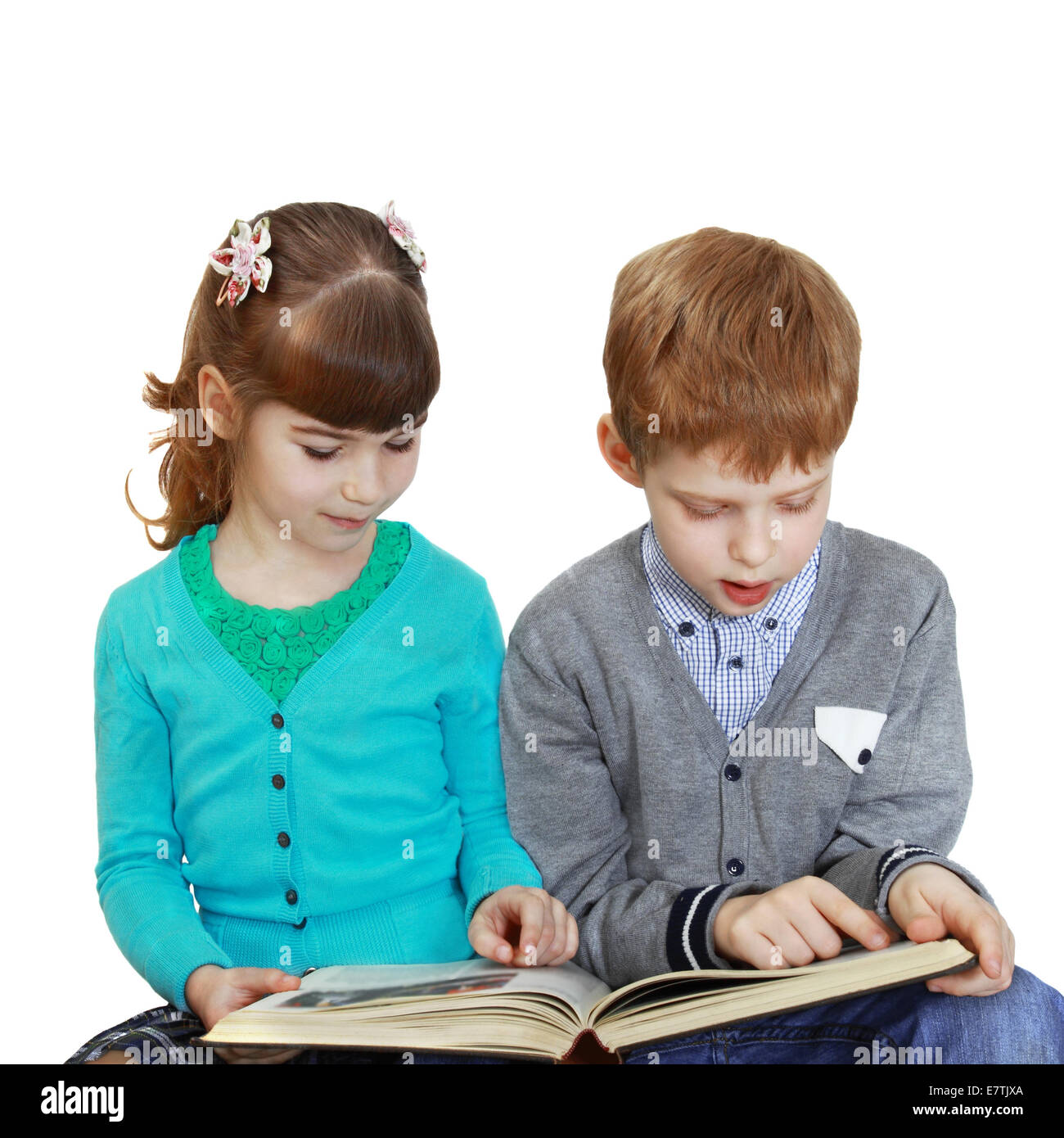 Boy and girl sit and read book isolated on white background Stock Photo ...