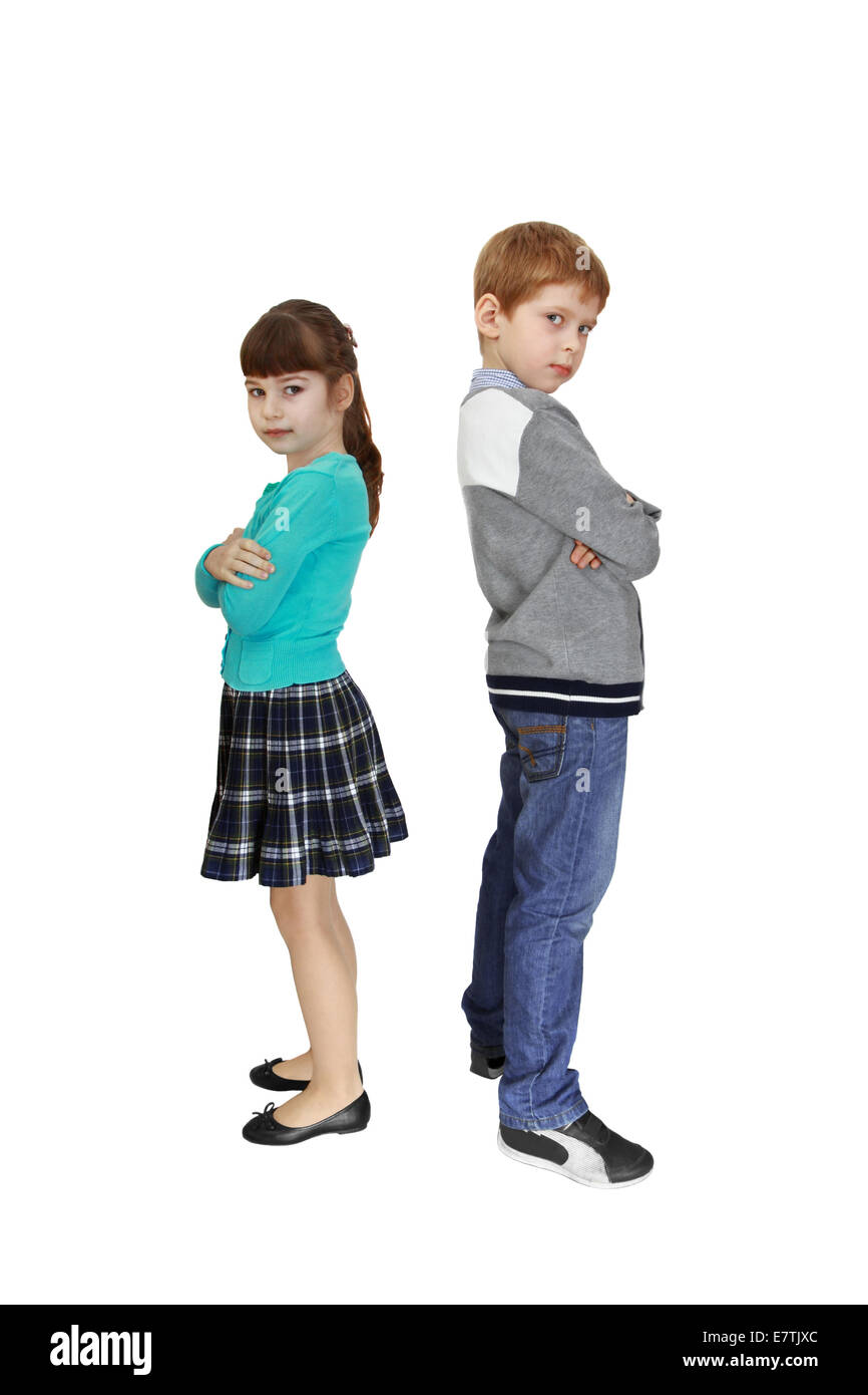 Boy and girl stand facing away from each other isolated on white ...