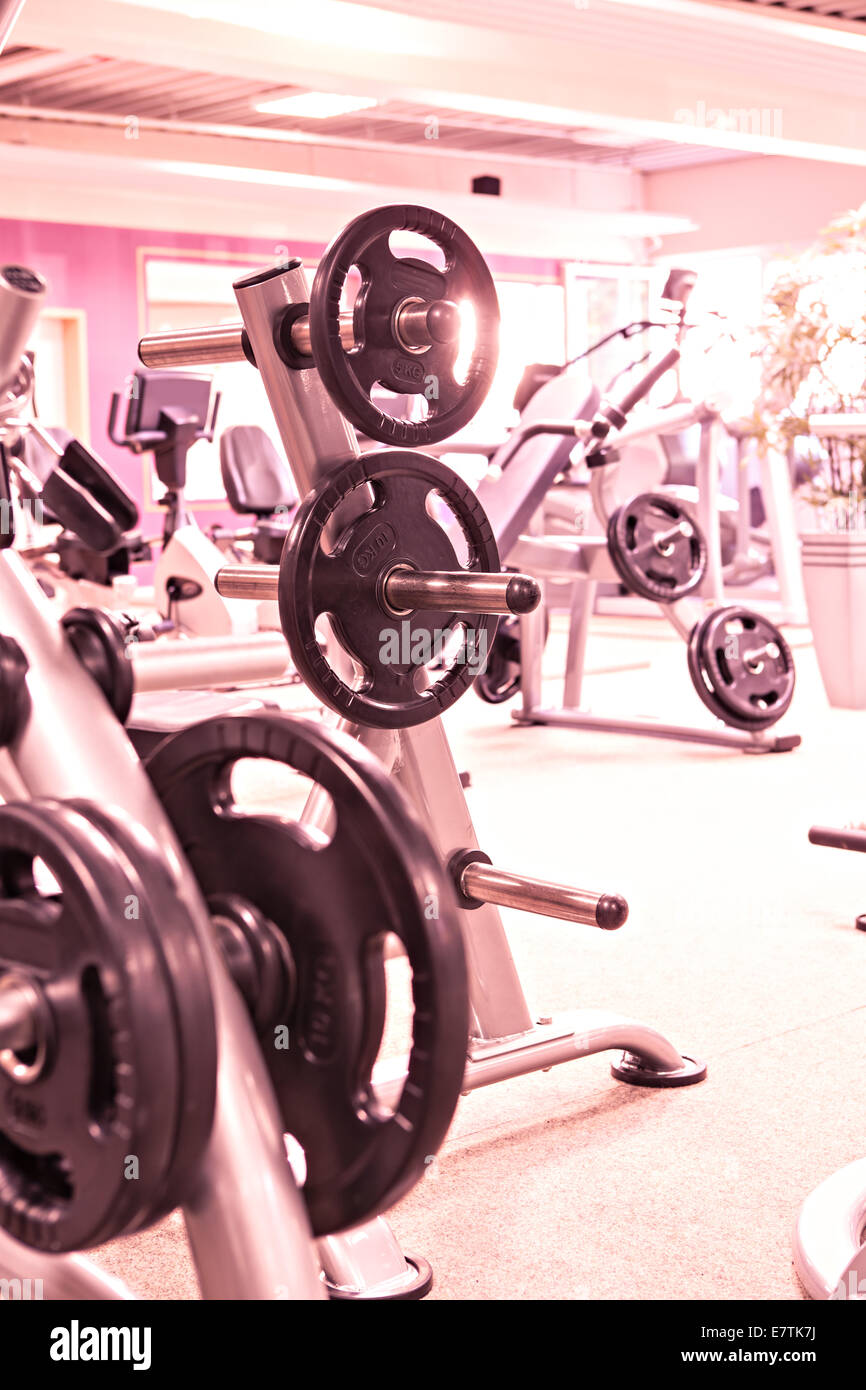 diverse equipment and machines at the gym room Stock Photo - Alamy