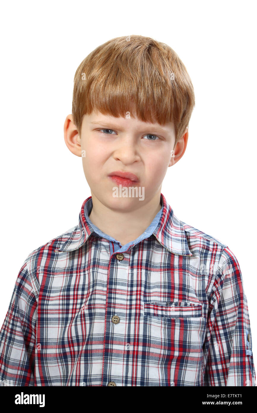 Boy with skeptical expression on face isolated on white background ...