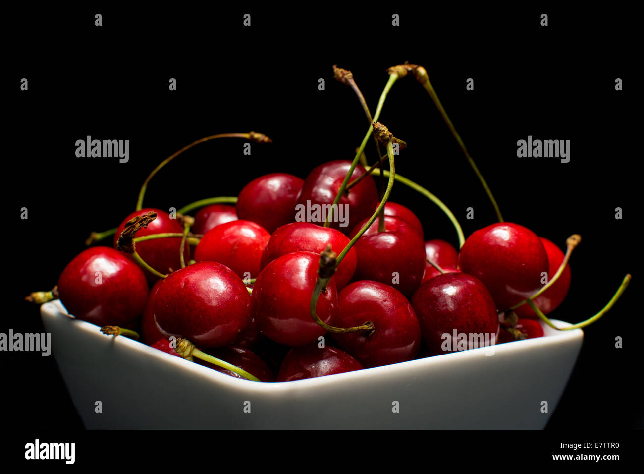 Cherries on dark background Stock Photo - Alamy