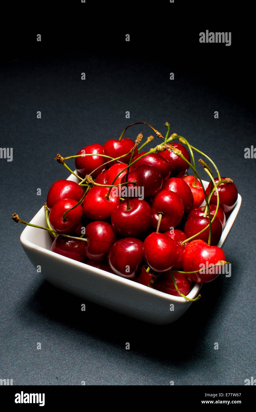 Dark red shiny cherries hi-res stock photography and images - Alamy