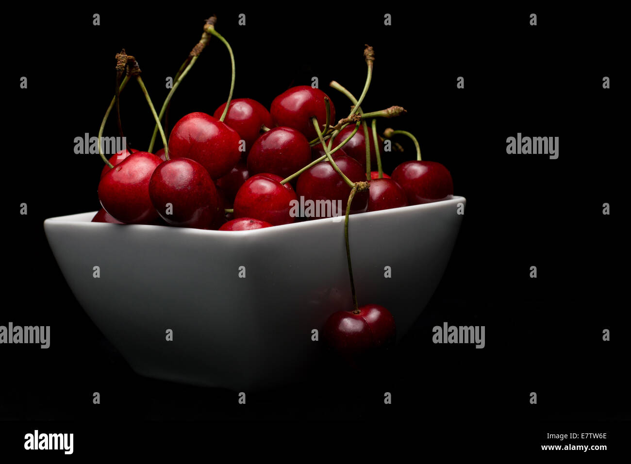 Cherries on dark background Stock Photo - Alamy