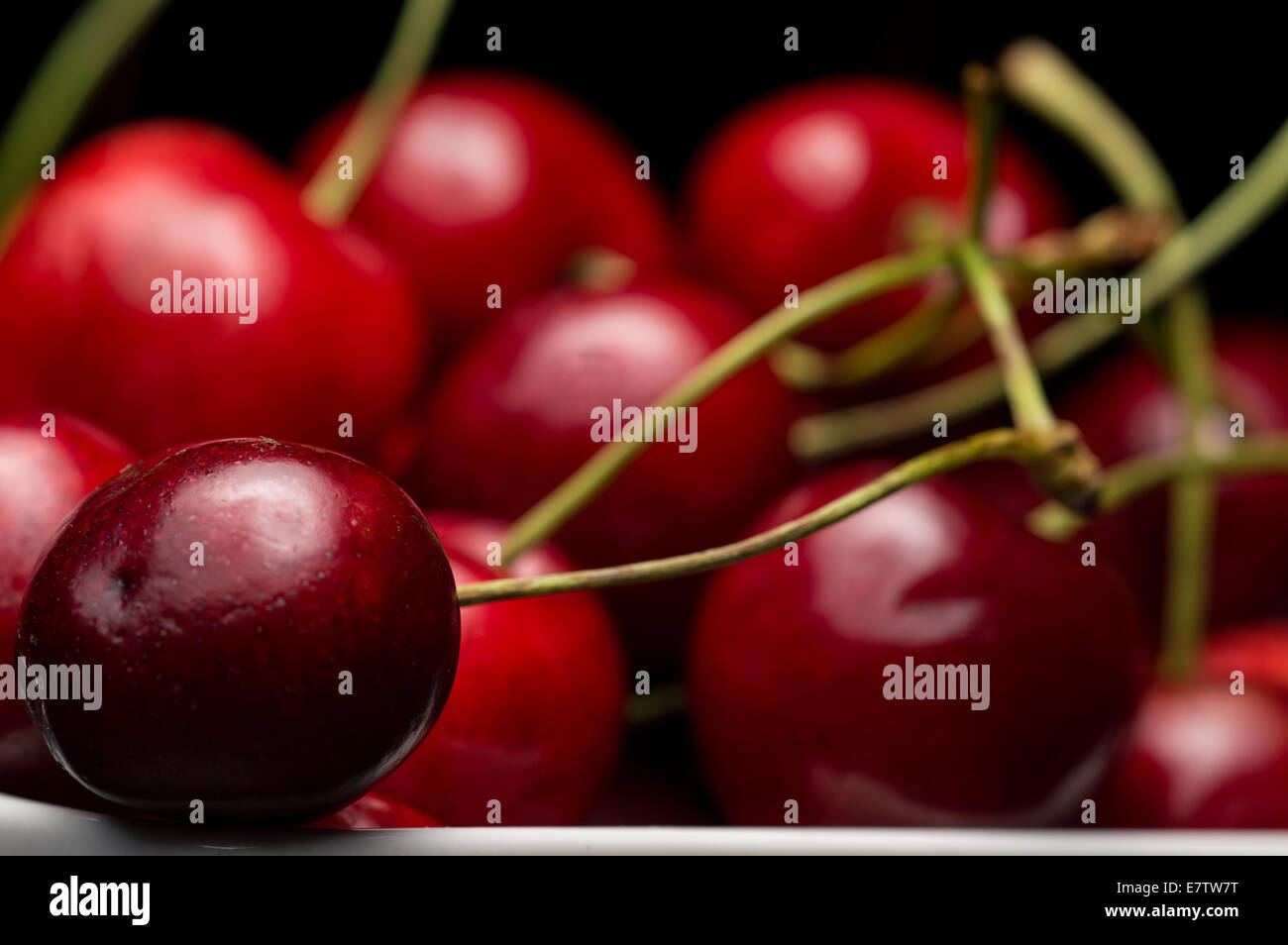Cherries on dark background Stock Photo - Alamy