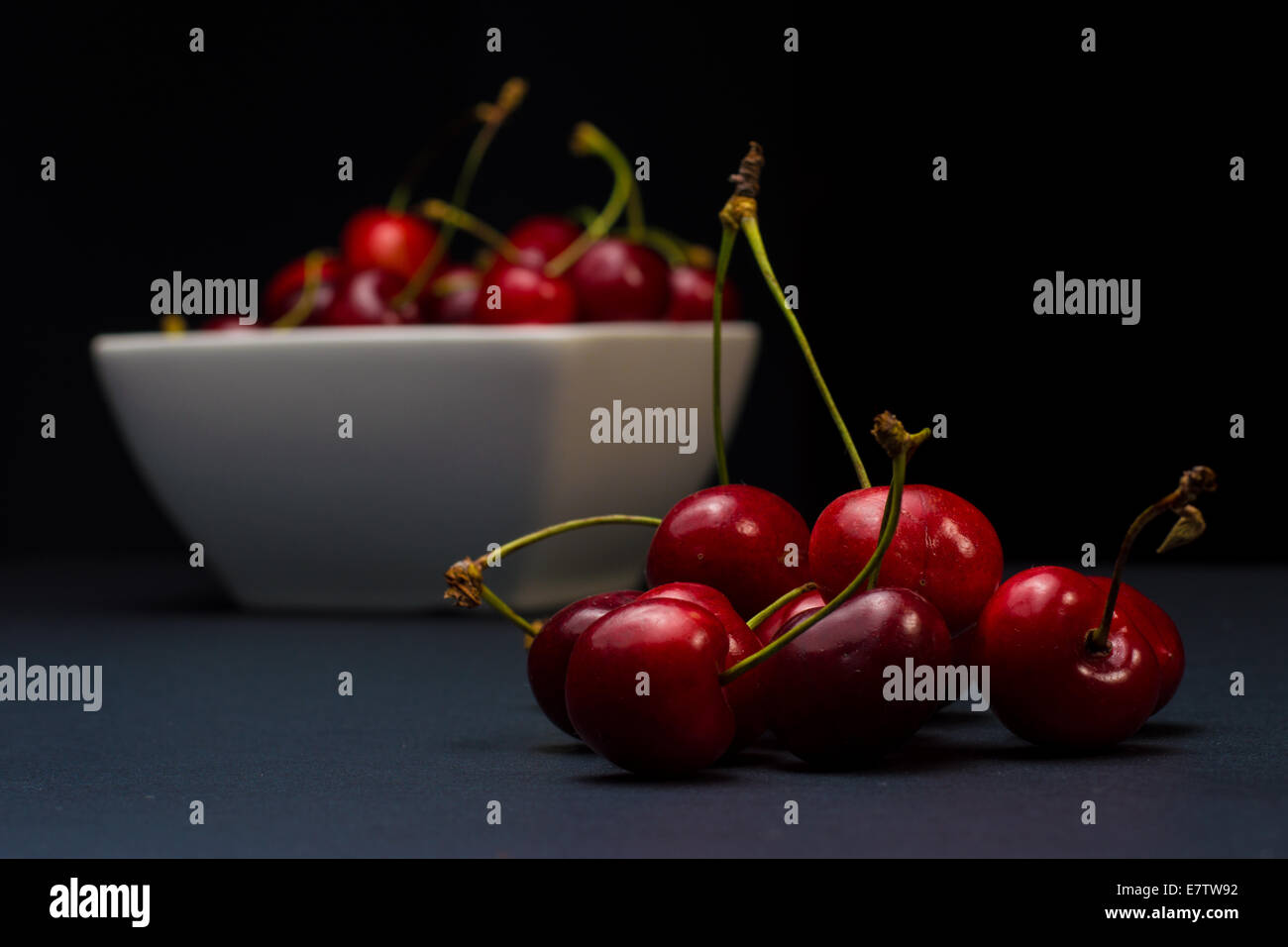 Cherries on dark background Stock Photo - Alamy
