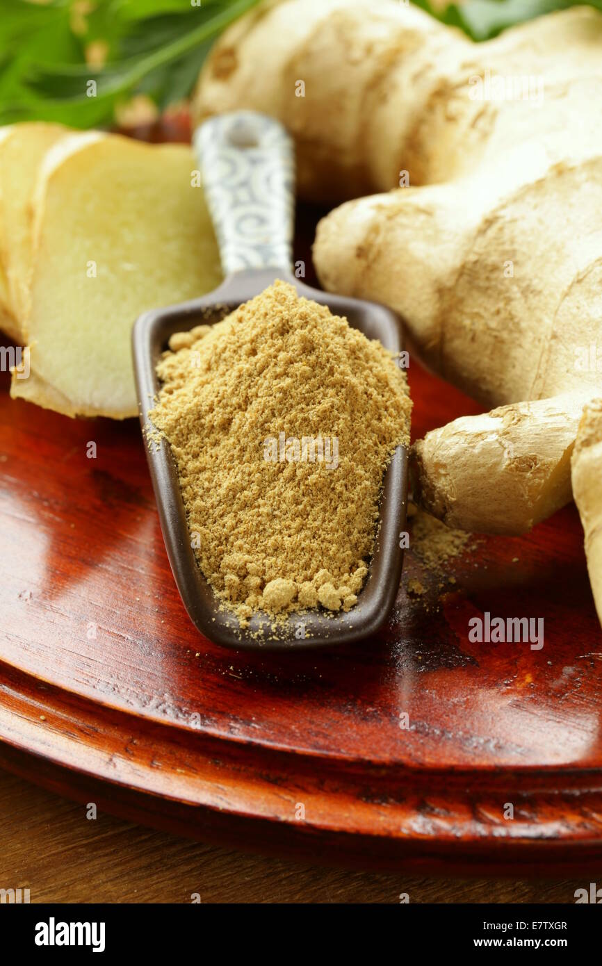 ground and fresh ginger traditional oriental spice Stock Photo - Alamy
