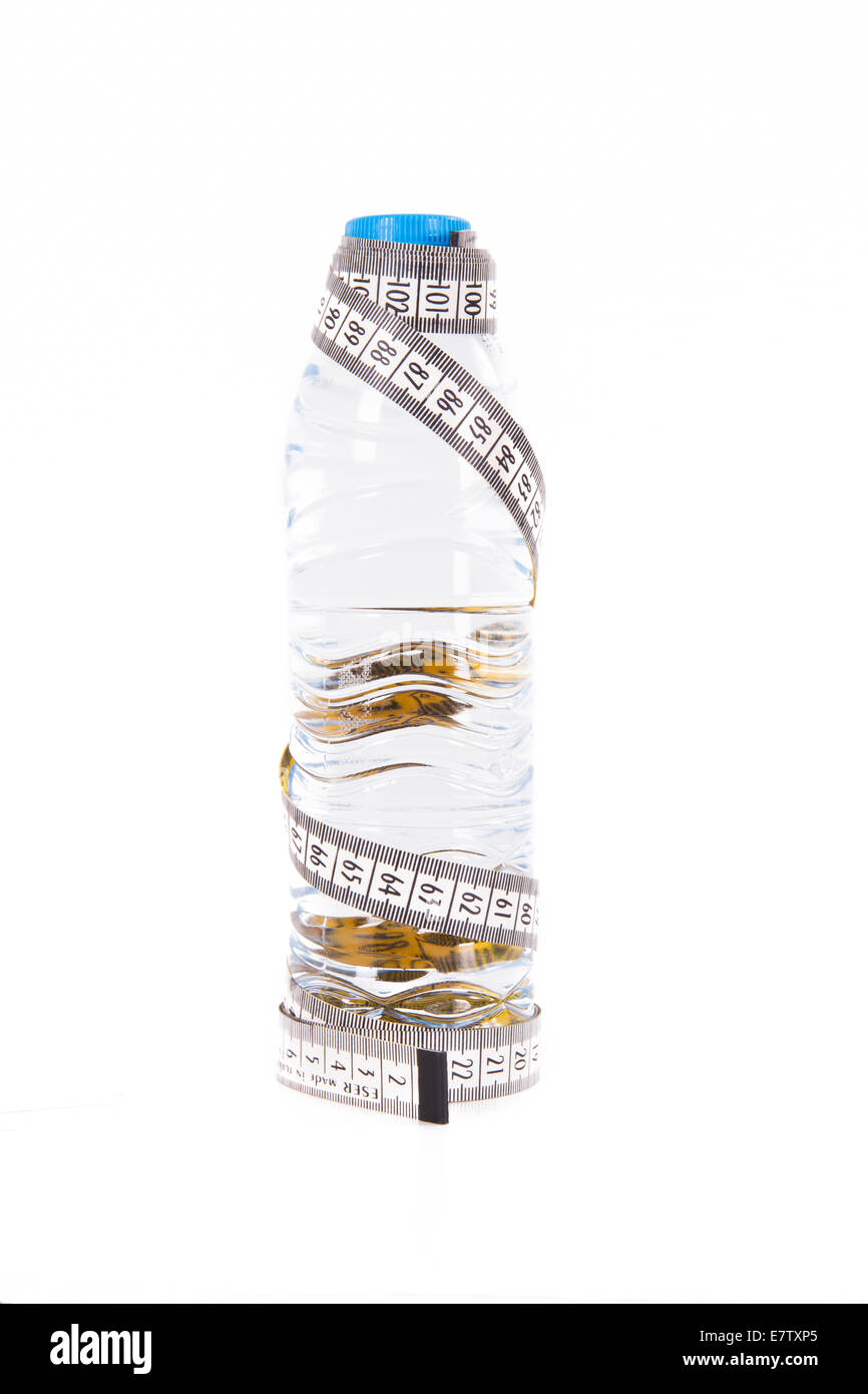 Plastic water bottle and tape measure, isolated on white background ...