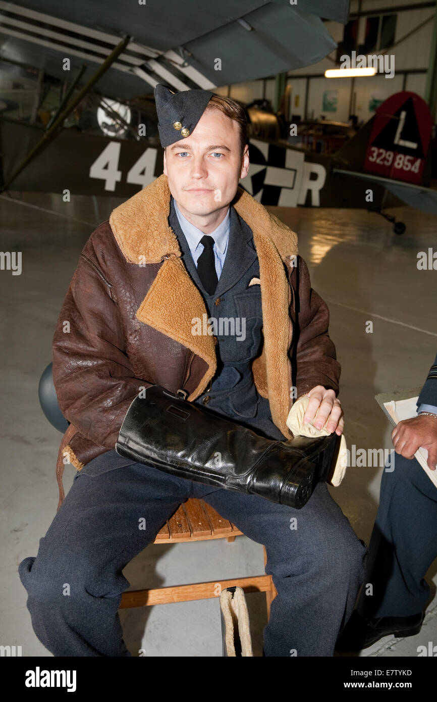 Wartime re enactors Lee Draper polishes his boots in the Biggin Hill ...