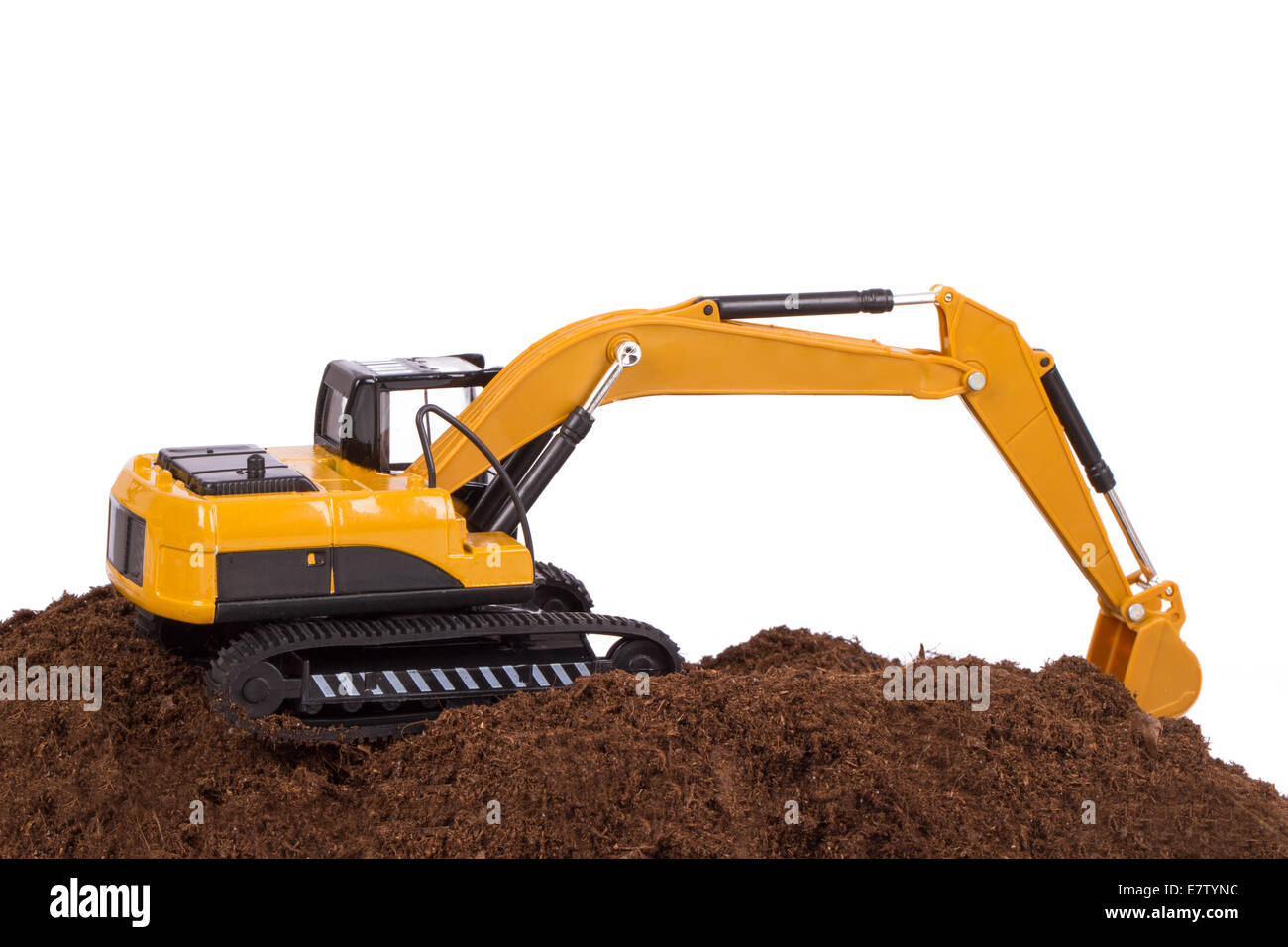 Construction machine, excavator on pile of soil digging a trench ...