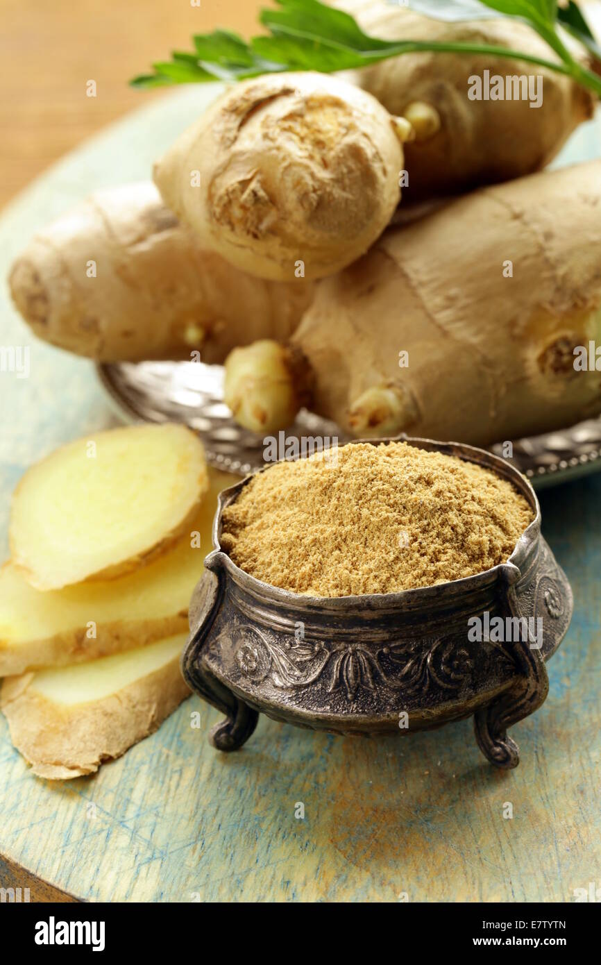 ground and fresh ginger traditional oriental spice Stock Photo - Alamy