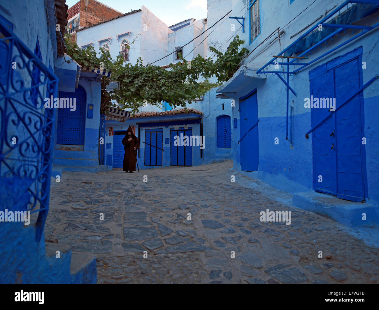 A hooded man in Chefchaouen Stock Photo - Alamy