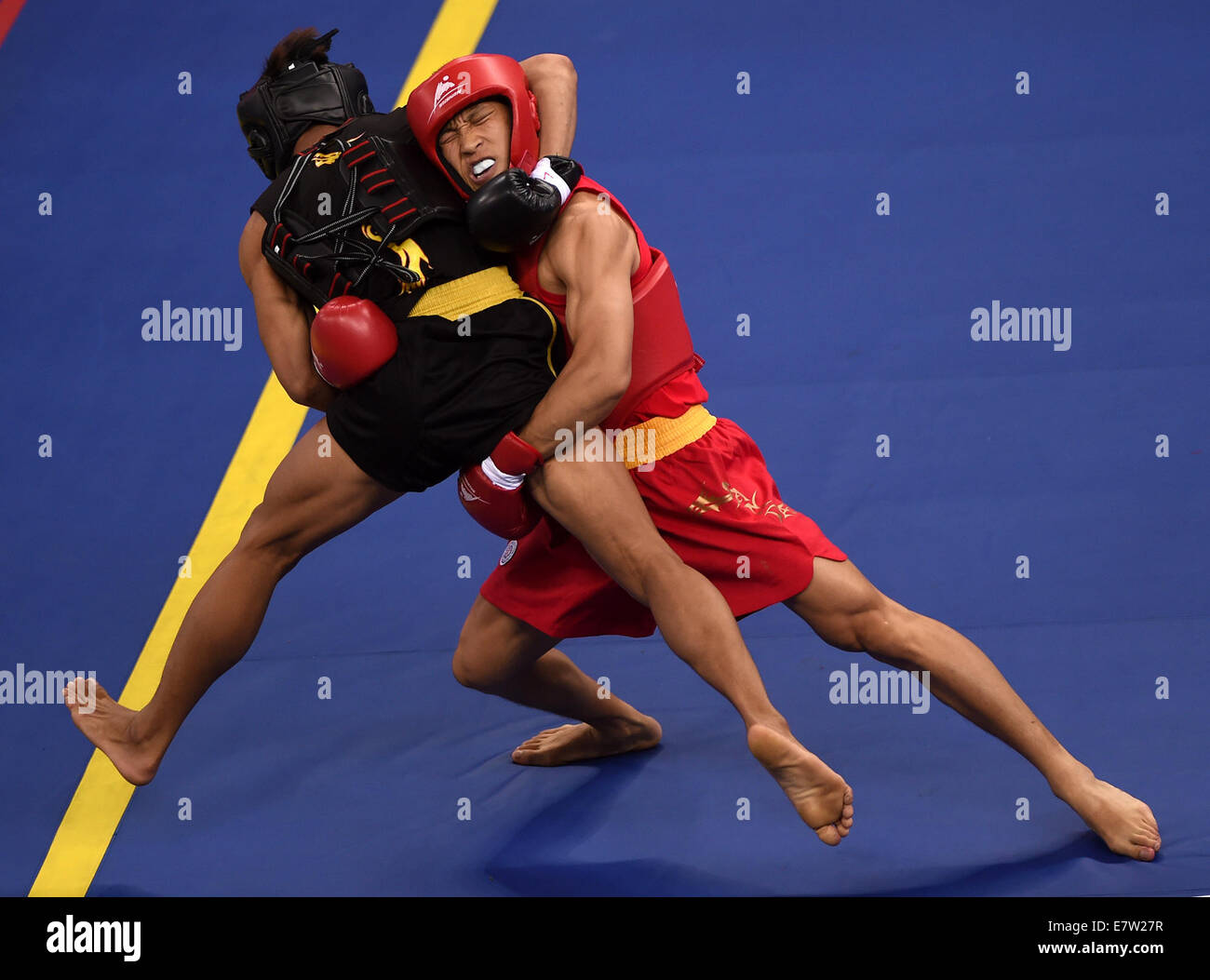 Incheon, South Korea. 24th Sep, 2014. Zhao Fuxiang (R) of China beats ...
