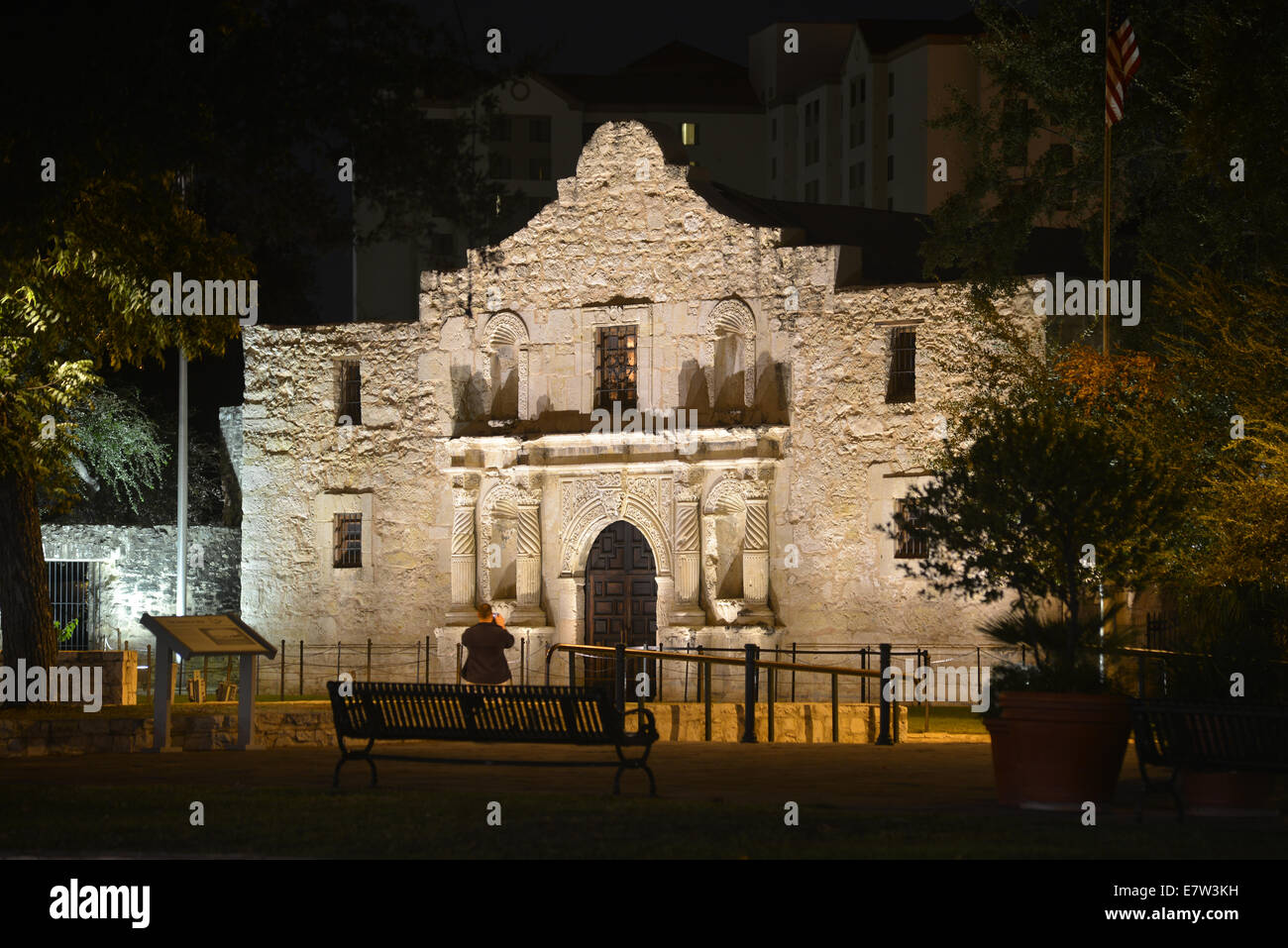A person takes photographs in front of the famed Alamo in San Antonio ...