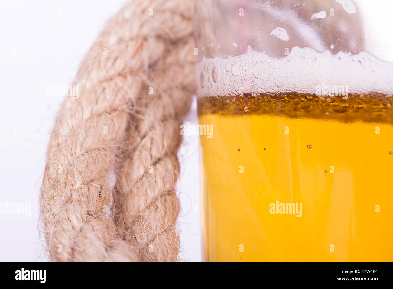 Close up view, full of beer glass and rope, isolated on white ...