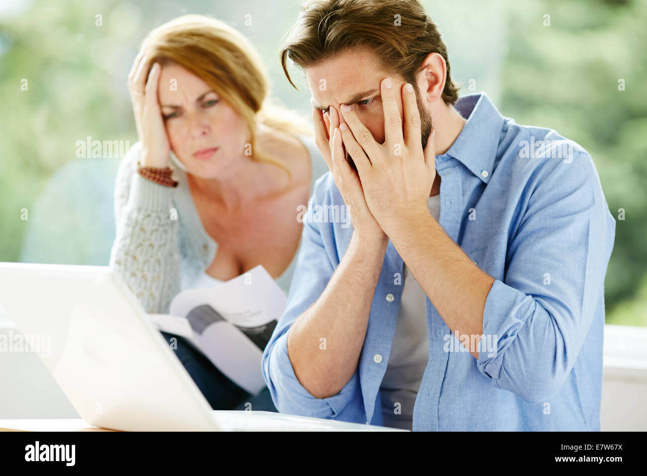 Couple working out finances Stock Photo - Alamy