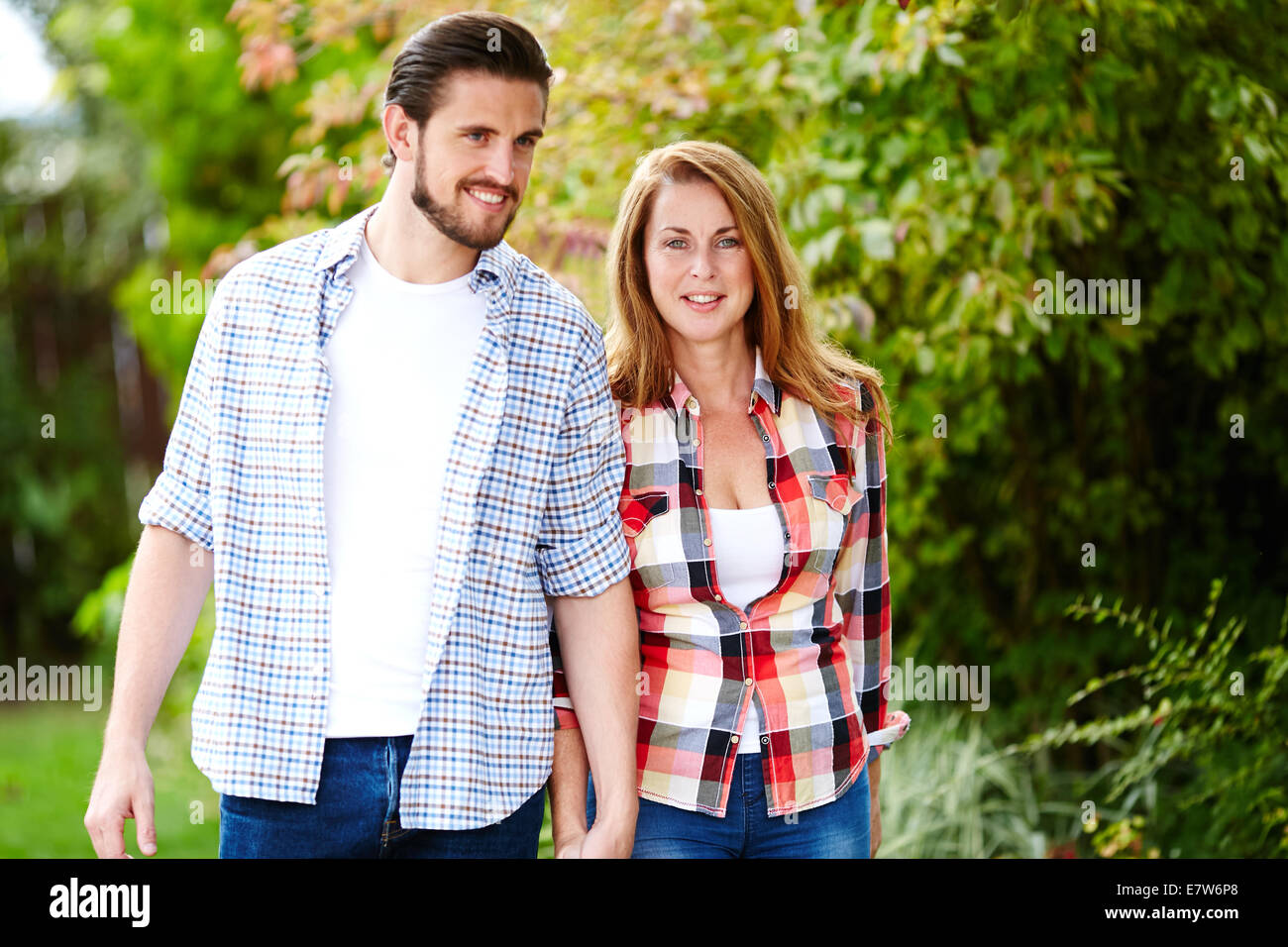 Happy couple walking together Stock Photo - Alamy