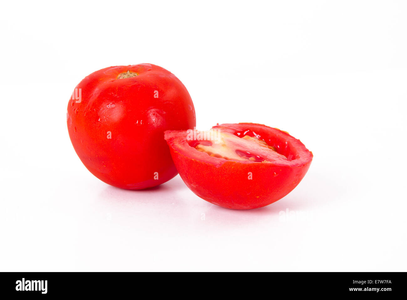 Red ripe tomato and cutted tomato, isolated on white background Stock ...