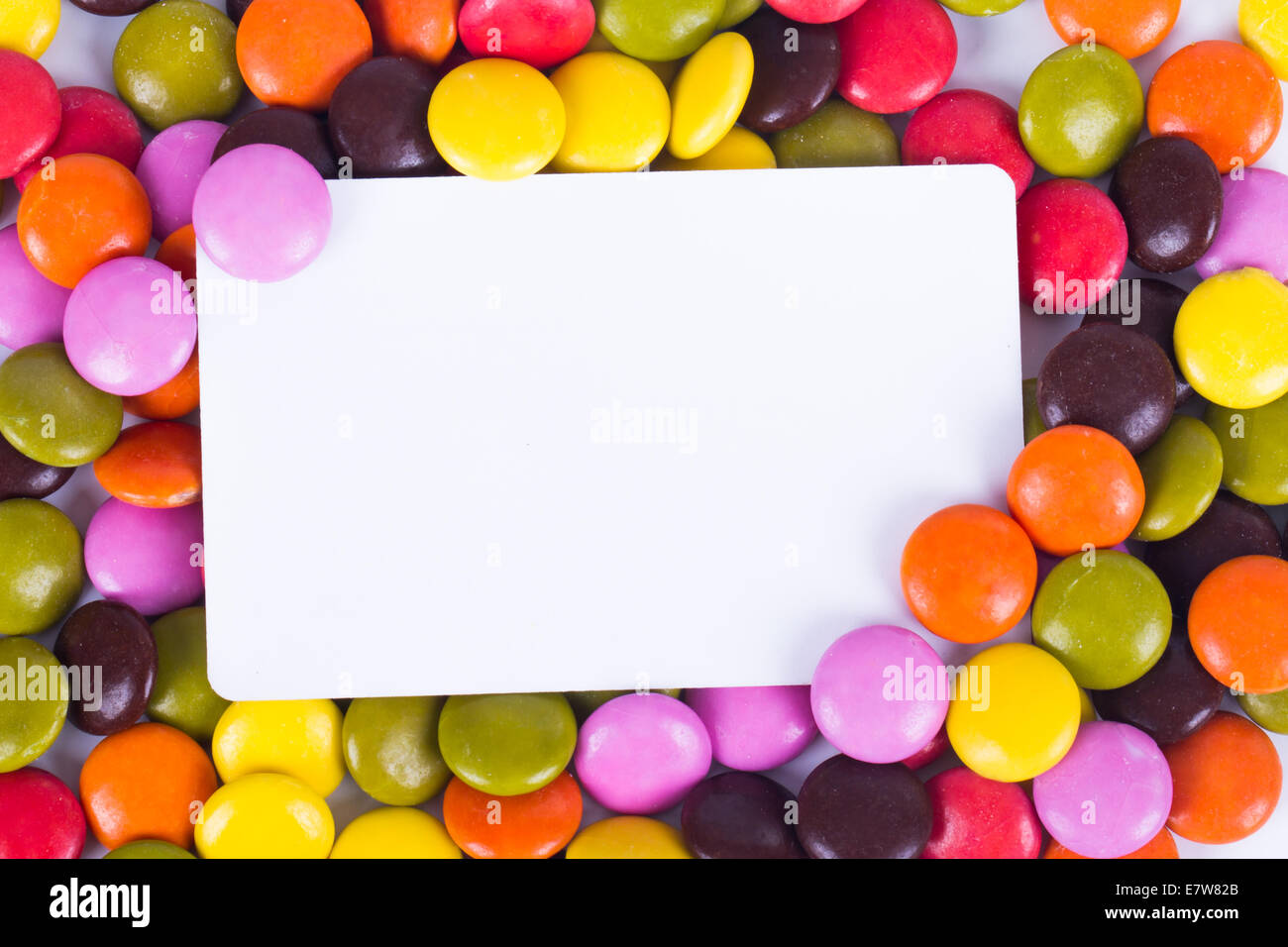 White, blank card with colorful sugar candies Stock Photo - Alamy