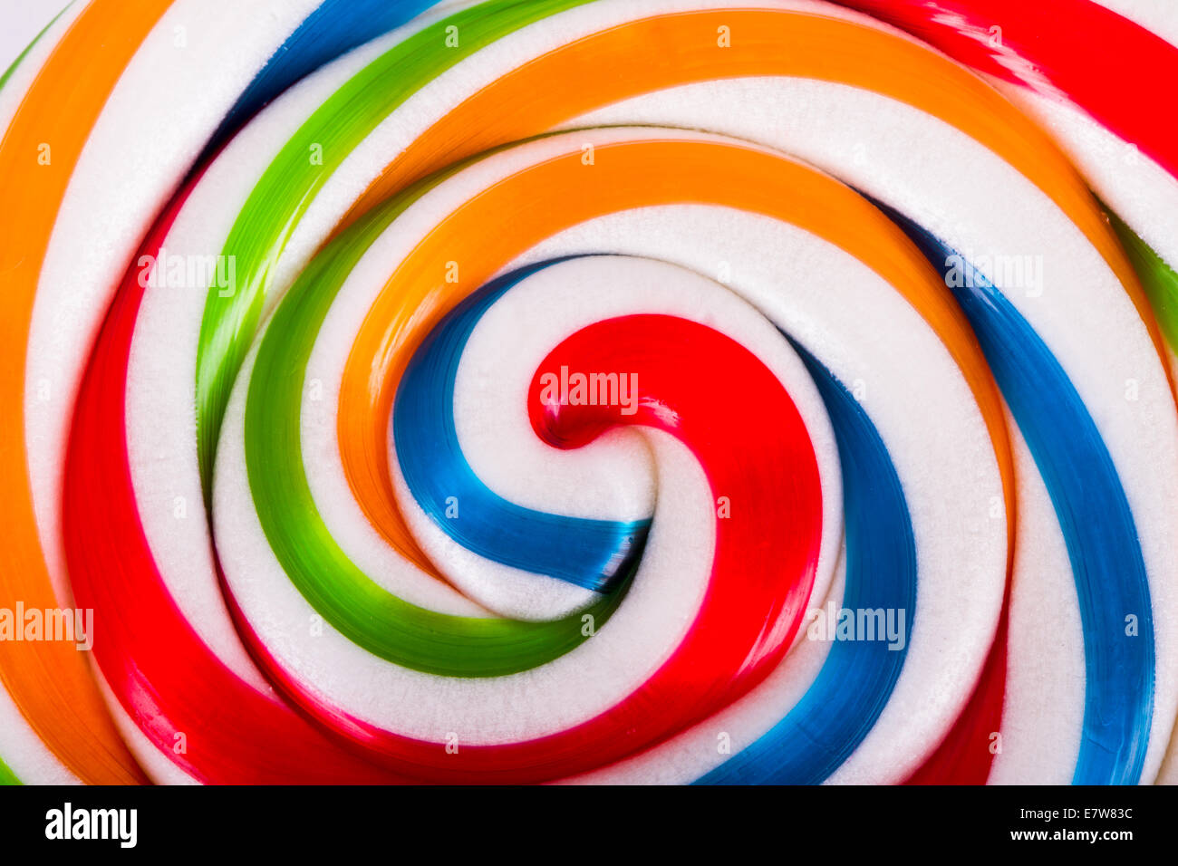 Colorful spiral lollipop candy as background Stock Photo - Alamy