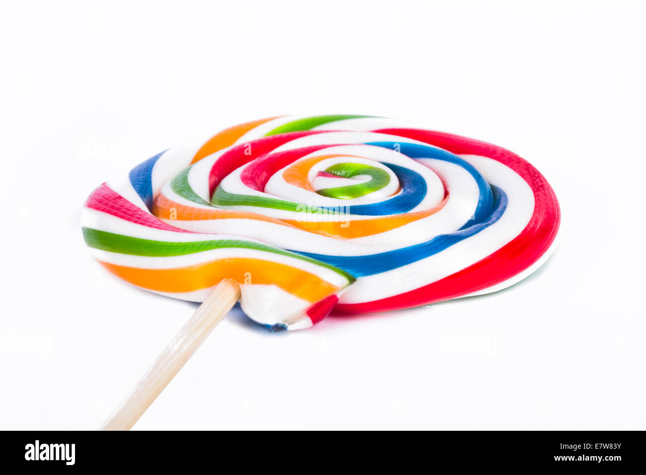Colorful spiral lollipop candy on stick, isolated on white background ...