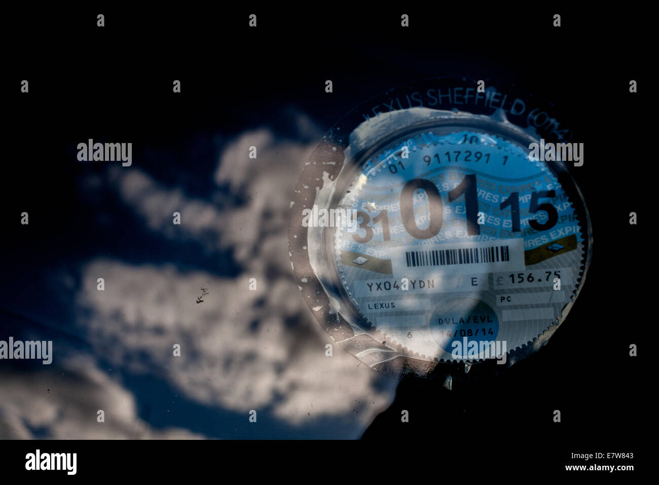 UK Paper tax disk stuck to the windscreen of a car in England Stock ...