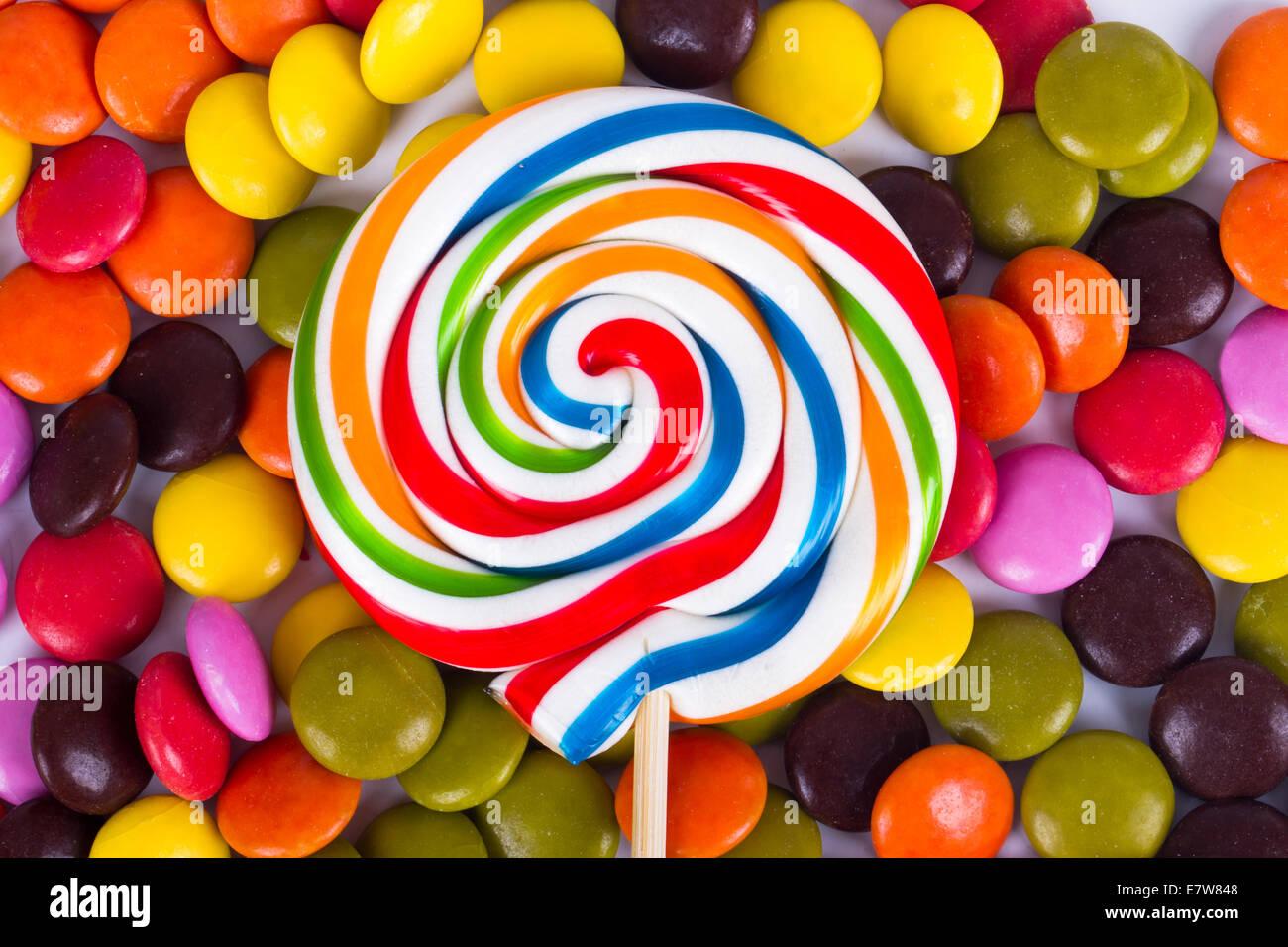 Colorful spiral lollipop candy on stick Stock Photo - Alamy