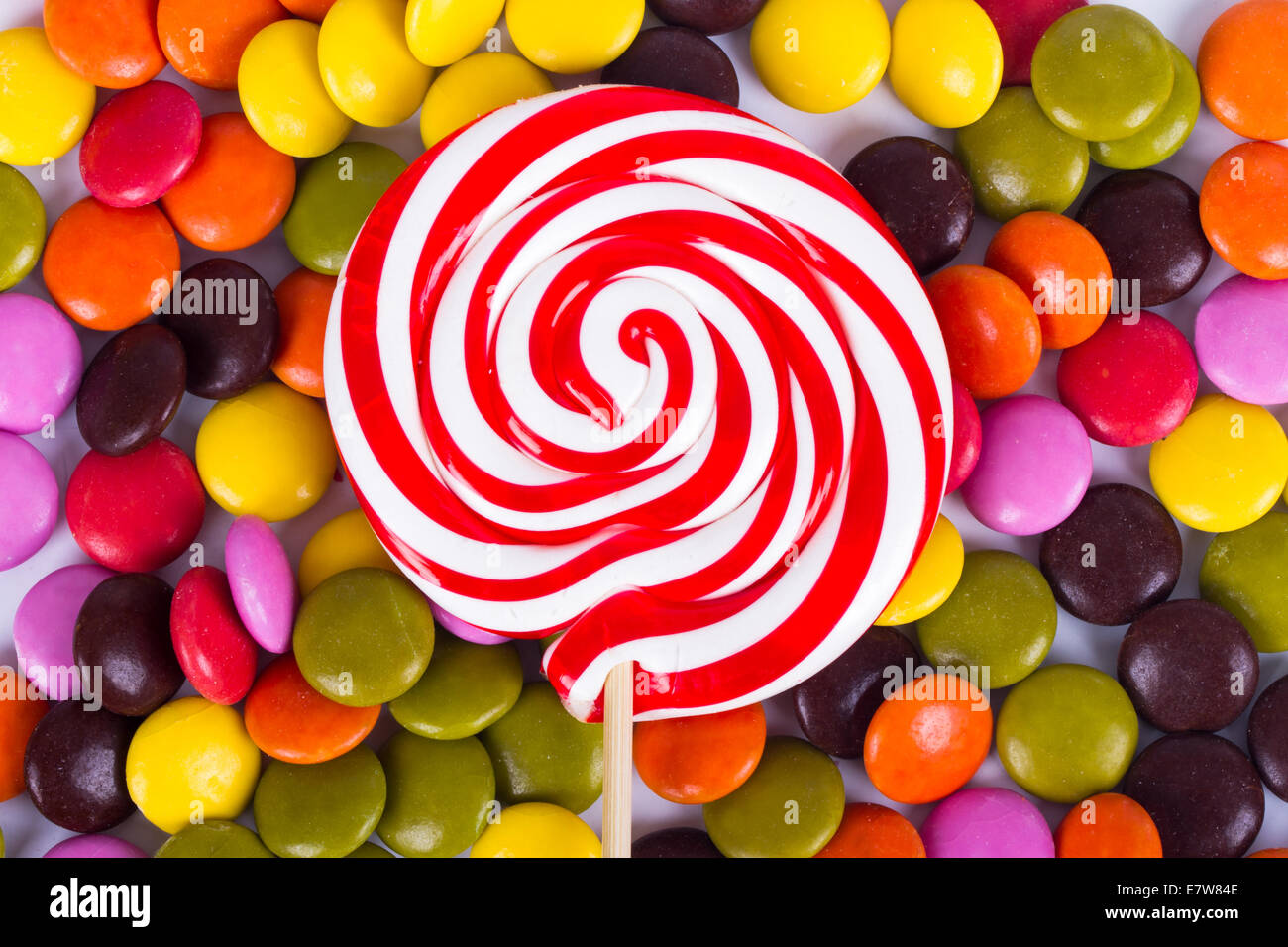 Colorful spiral lollipop candy on stick Stock Photo - Alamy
