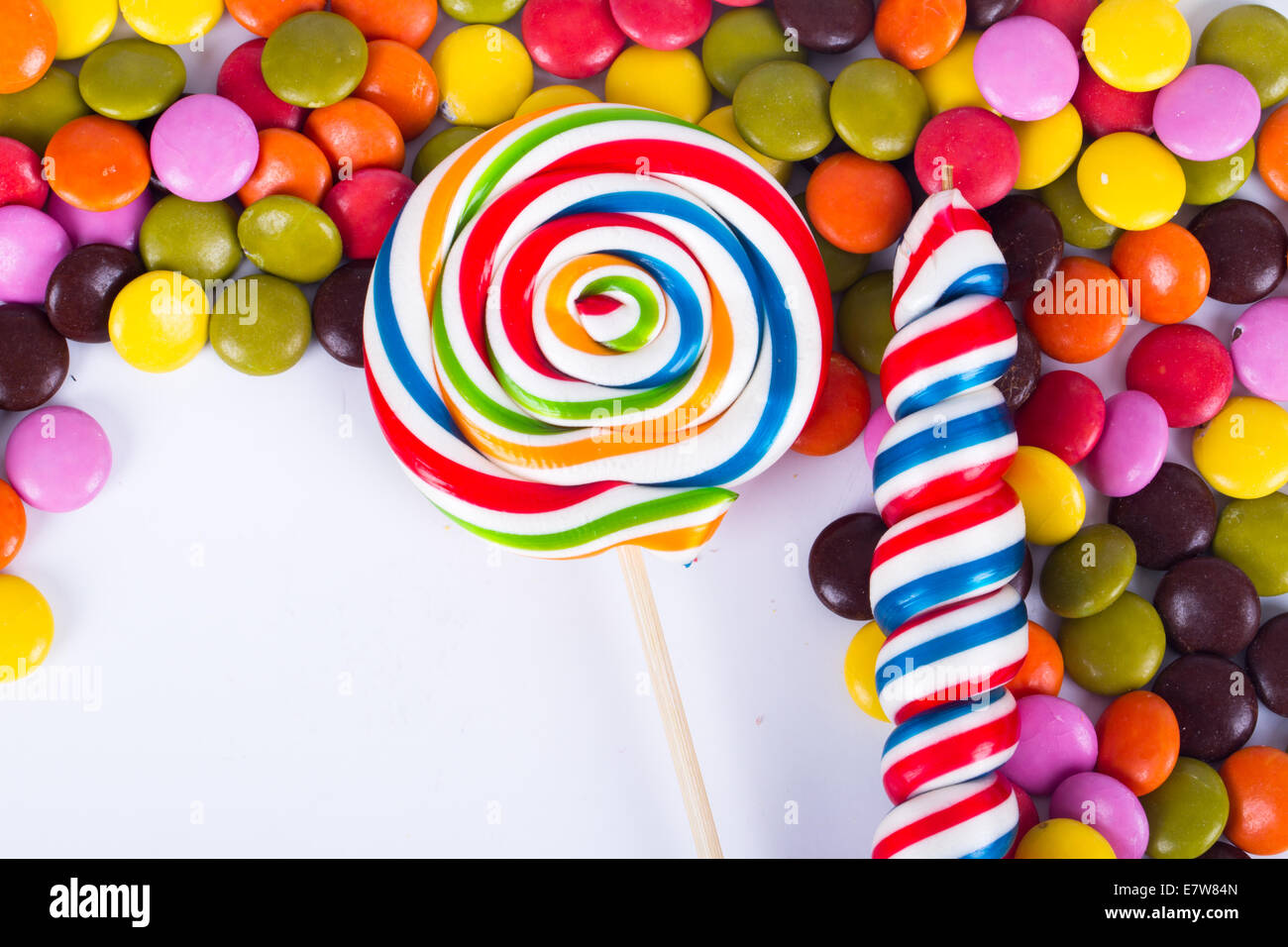 Colorful spiral lollipop candy on stick, isolated on white background ...